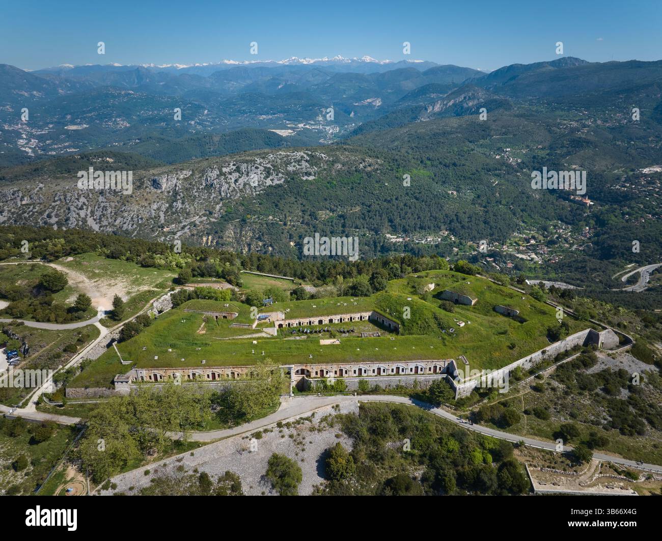 AERIAL VIEW. Fort de la Revère, snow-capped Mercantour Mountains in the ...