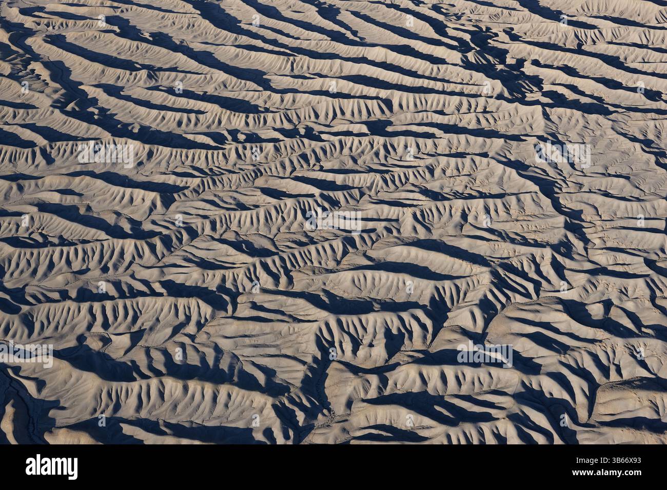 AERIAL VIEW. Ravines at the foot of Factory Butte. Wayne County, Utah ...