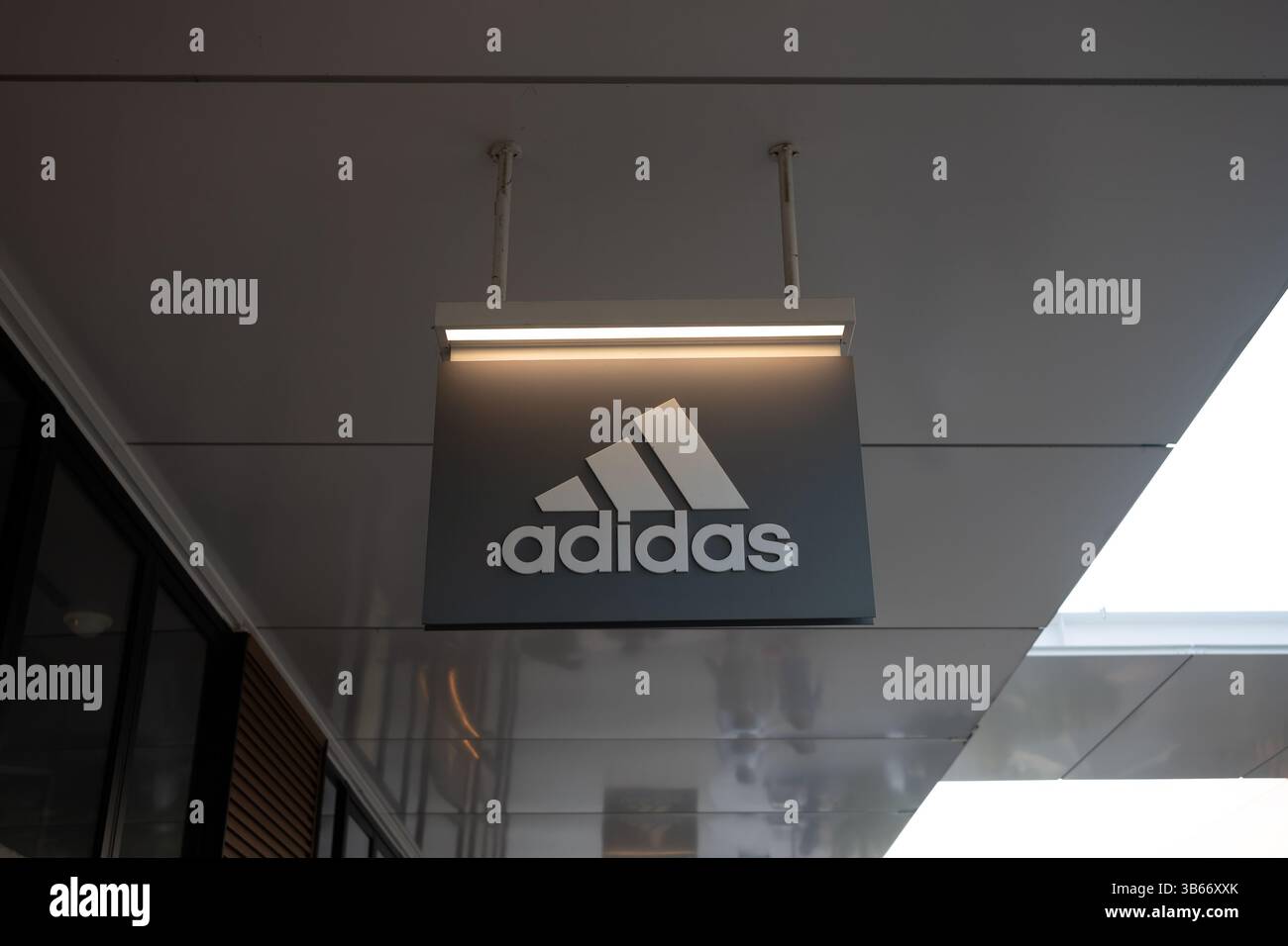 Adidas outlet store storefront logo and banner Stock Photo - Alamy