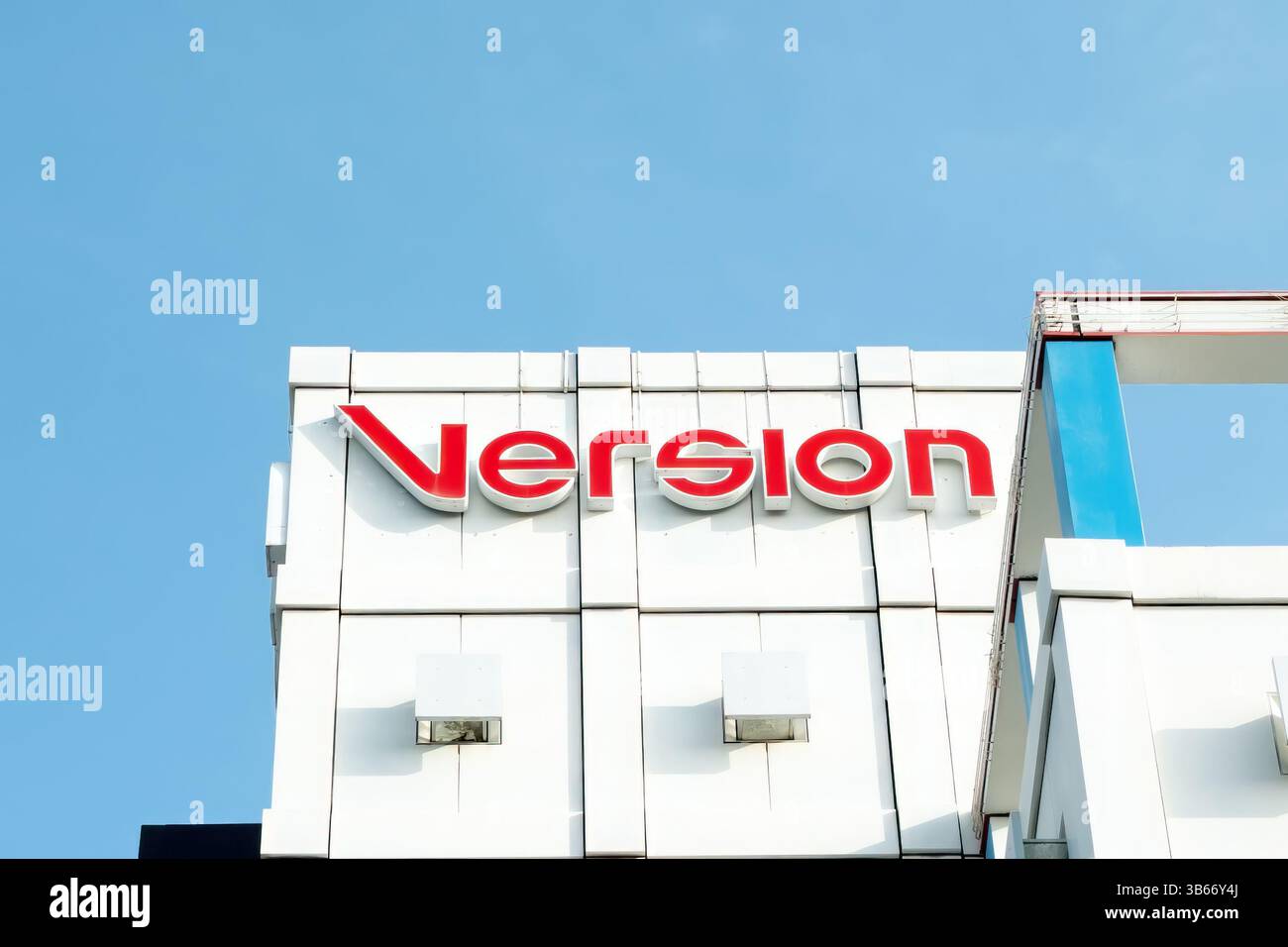 Version Group car dealer building logo Stock Photo - Alamy
