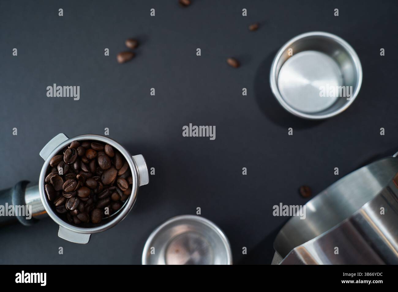 Portafilter, beans, and barista tools on black background—perfect setup ...