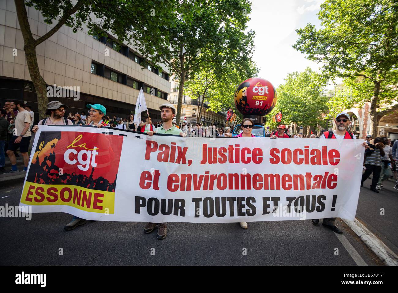 Paris, France. 01st May, 2025. CGT unionists hold a banner that says ...