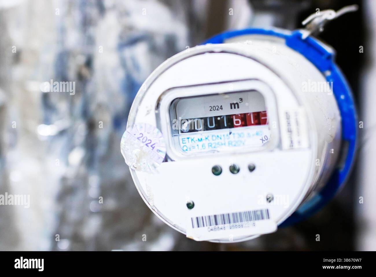 This image showcases a closeup view of a water meter, which displays a ...
