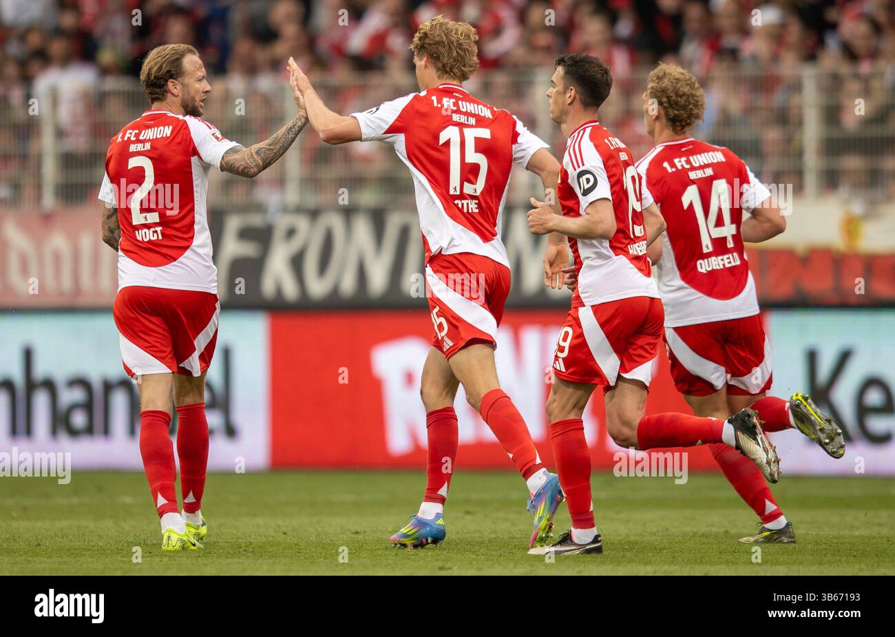 Berlin's Tom Rothe, centre left, celebrates with teammates after ...