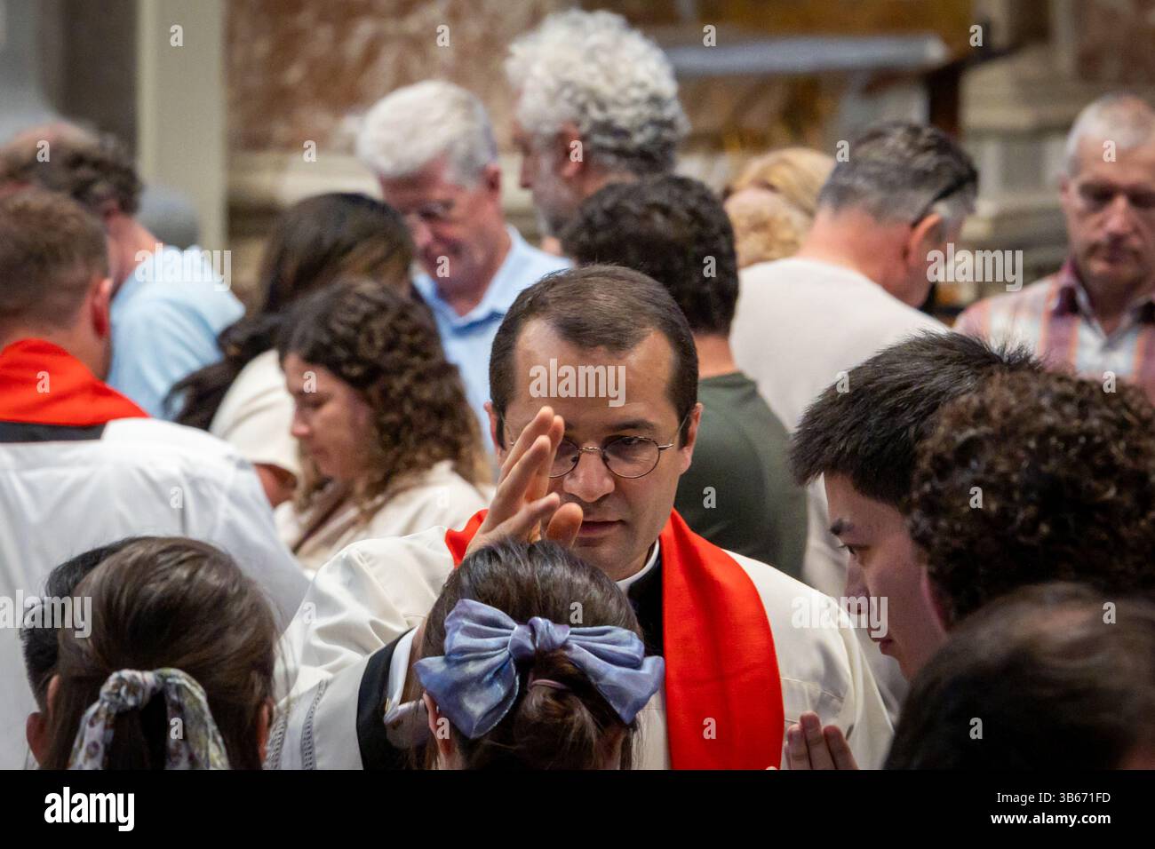 Vatican City - April 30, 2025: The faithful receive the host from the ...