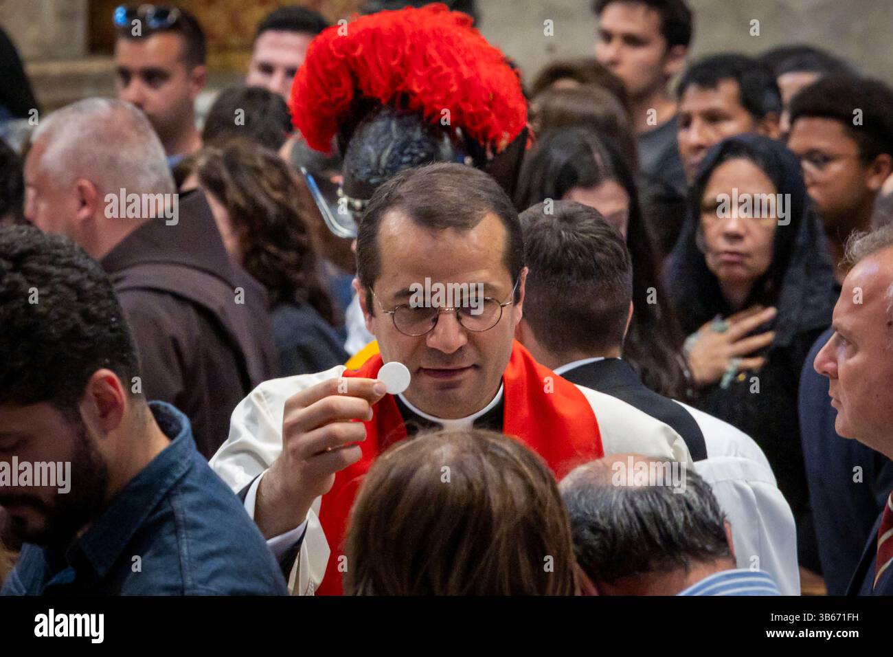 Vatican City - April 30, 2025: The faithful receive the host from the ...