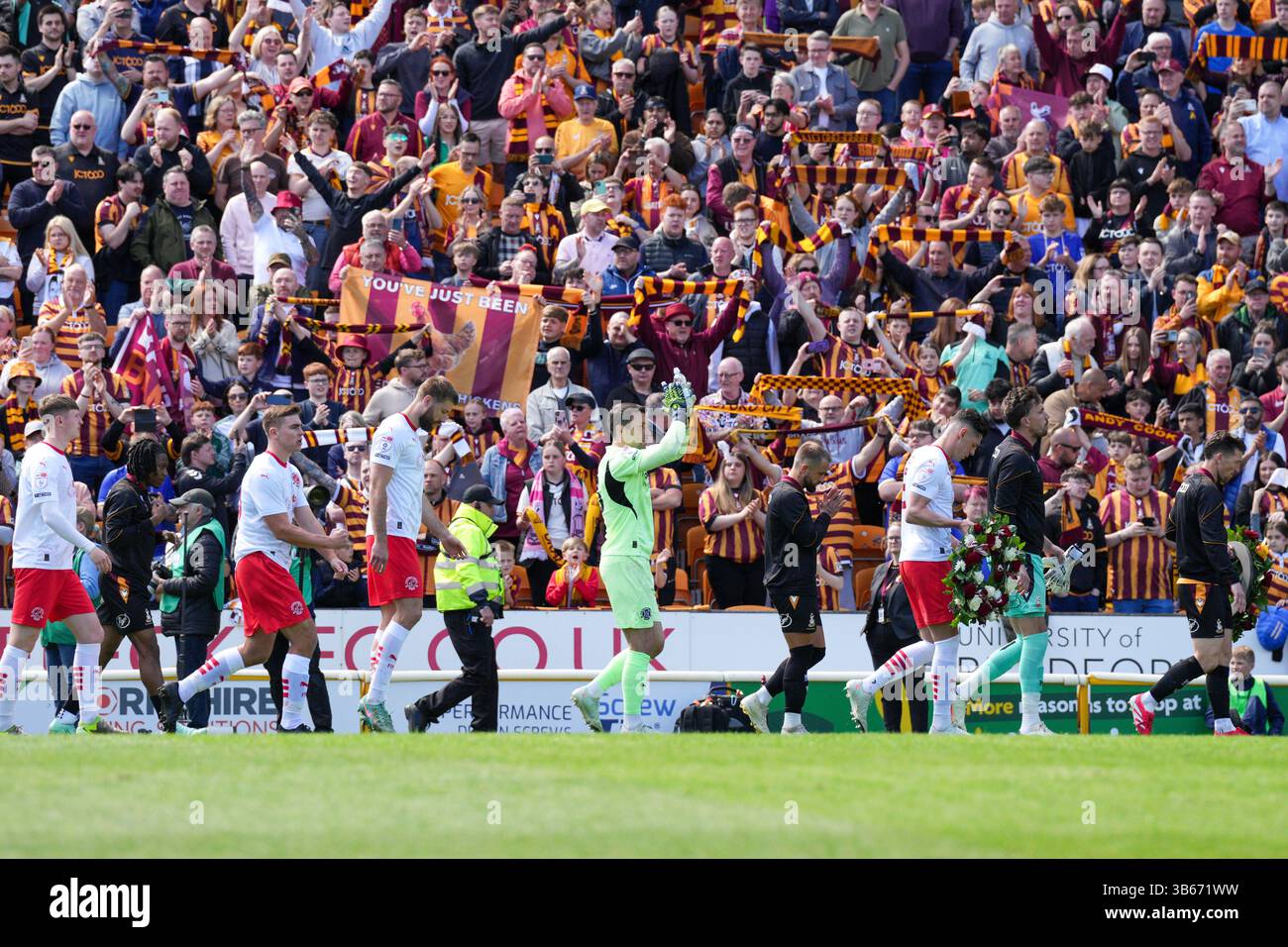 General crowd shot of a packed stadium at Bradford. Players emerge from ...