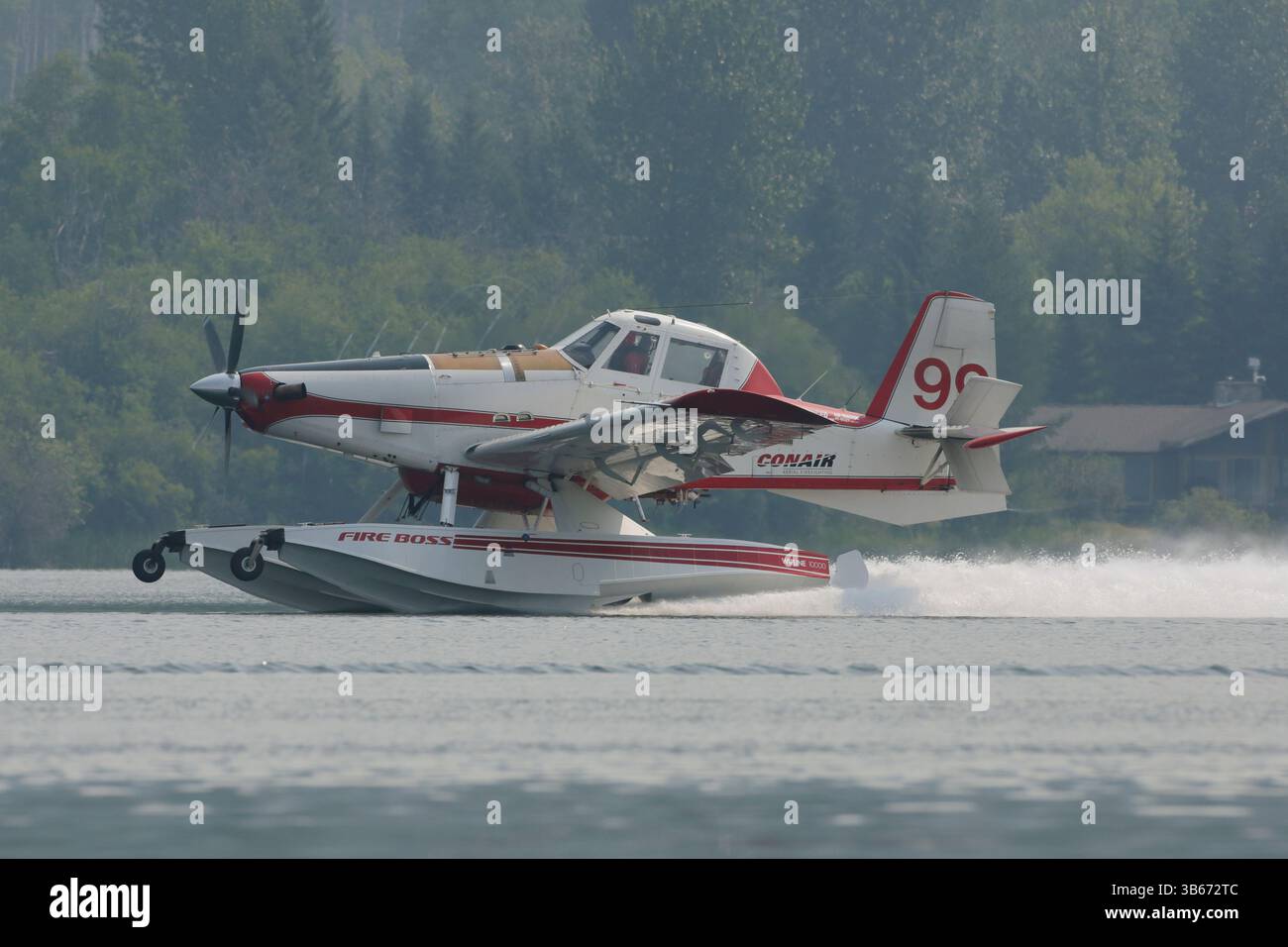 Air Tractor AT-802 Firefighting Airplane taking off from lake Stock ...