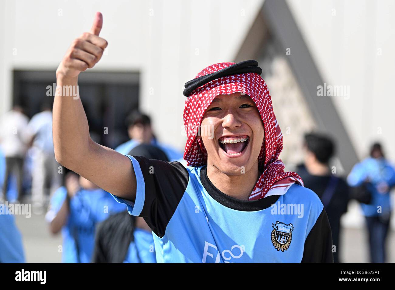 A Kawasaki Frontale fans cheers outside at Alinma Stadium before the ...