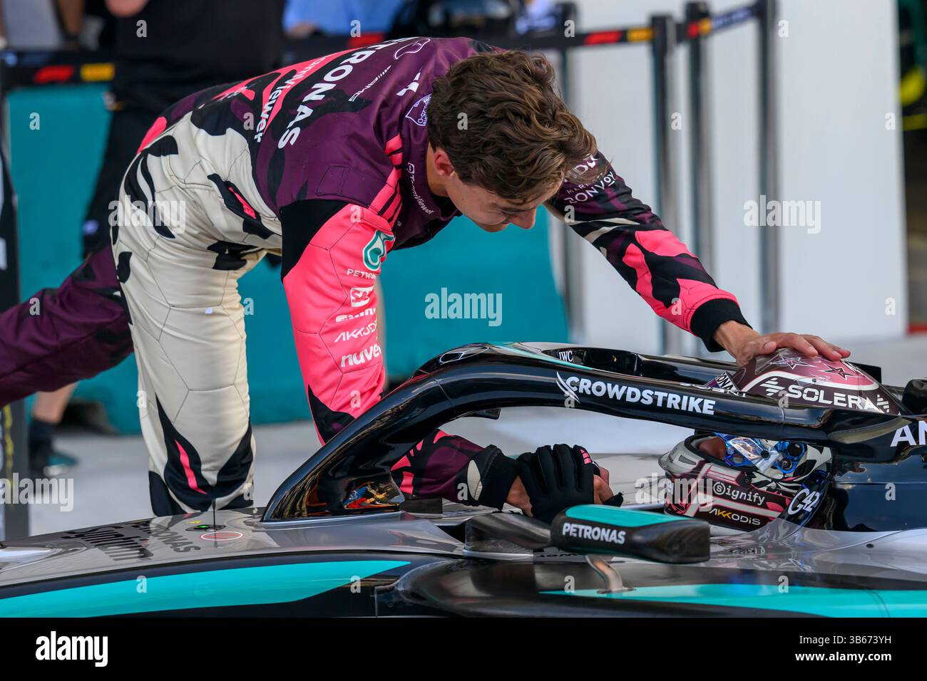 Mercedes-AMG PETRONAS Formula One Team driver George Russell (left), of ...