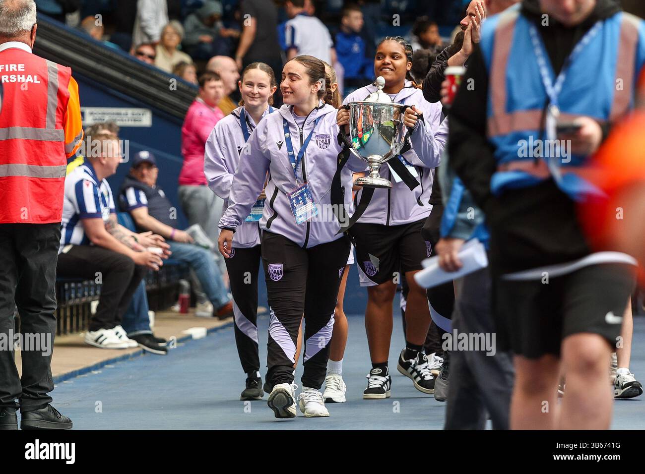 WBA Women do a lap of honour with their Birmingham FA trophy during the ...