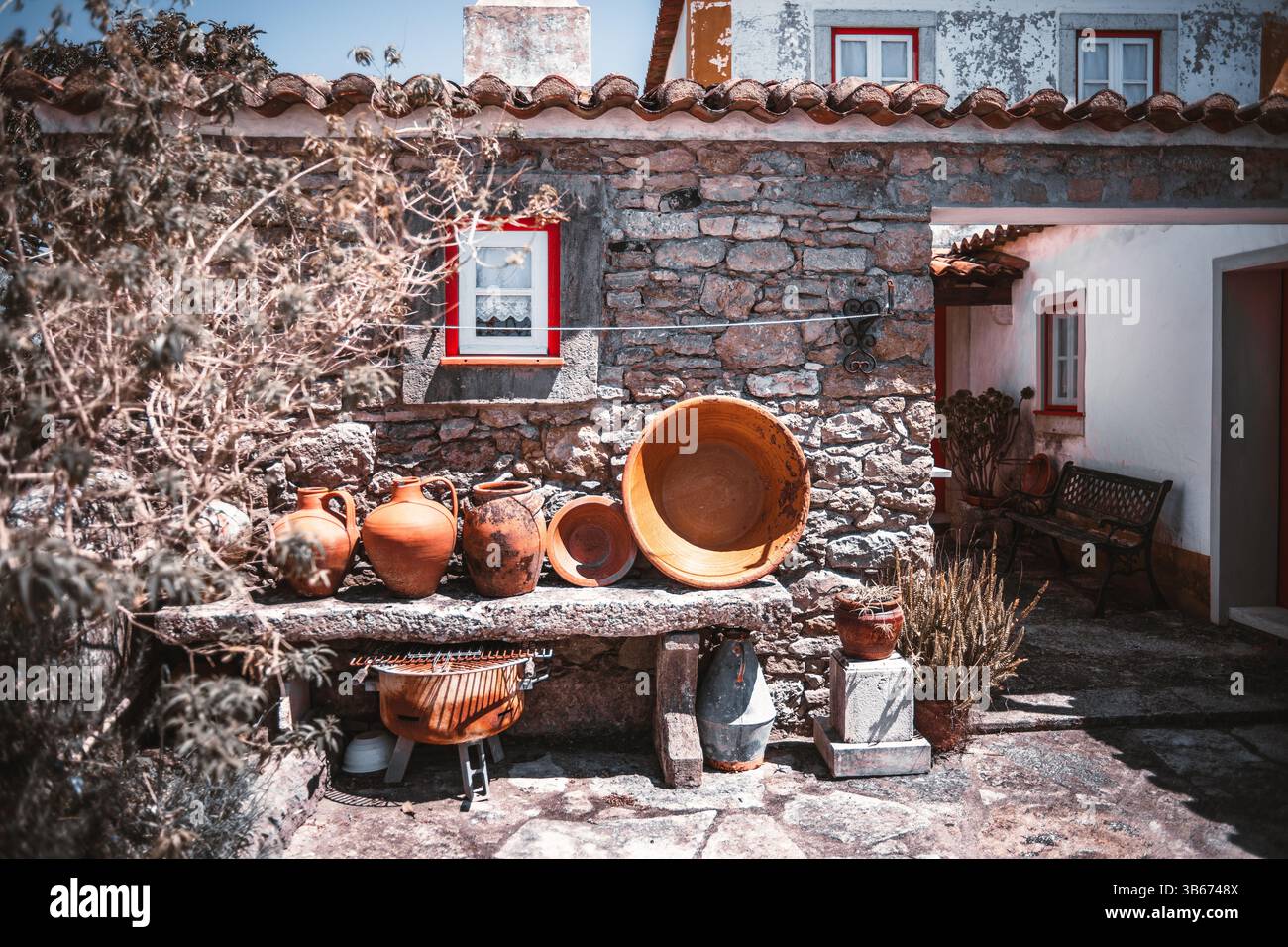 Traditional stone courtyard in Aldeia da Mata Pequena with rustic ...
