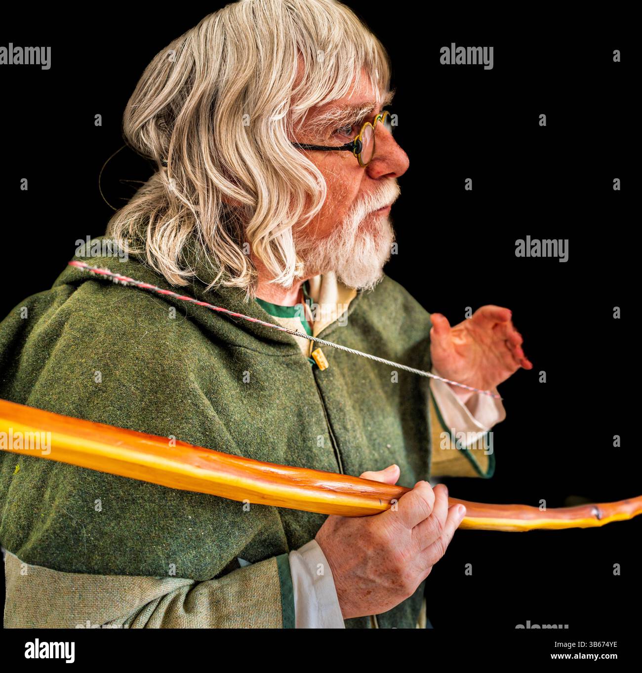 Portrait of a male medieval bow and arrow maker at a medieval event in ...