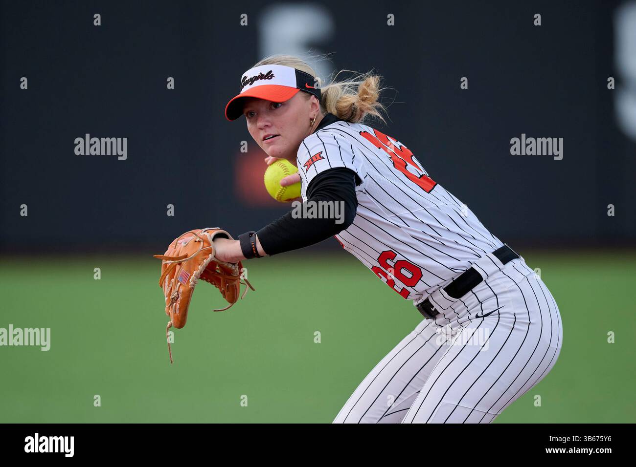 Oklahoma State Cowgirls second baseman Rosie Davis (26) throws to first ...