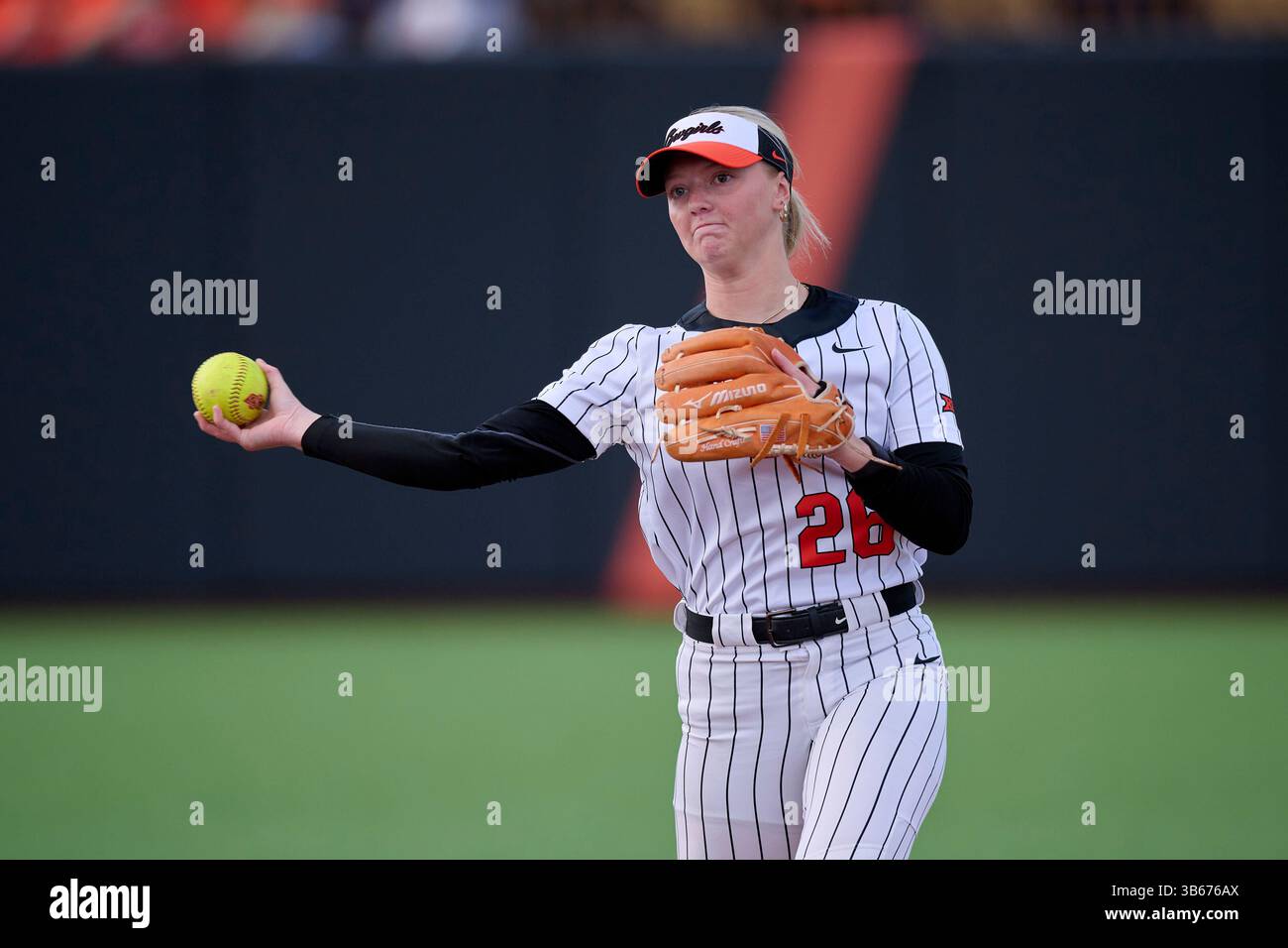 Oklahoma State Cowgirls second baseman Rosie Davis (26) throws to first ...