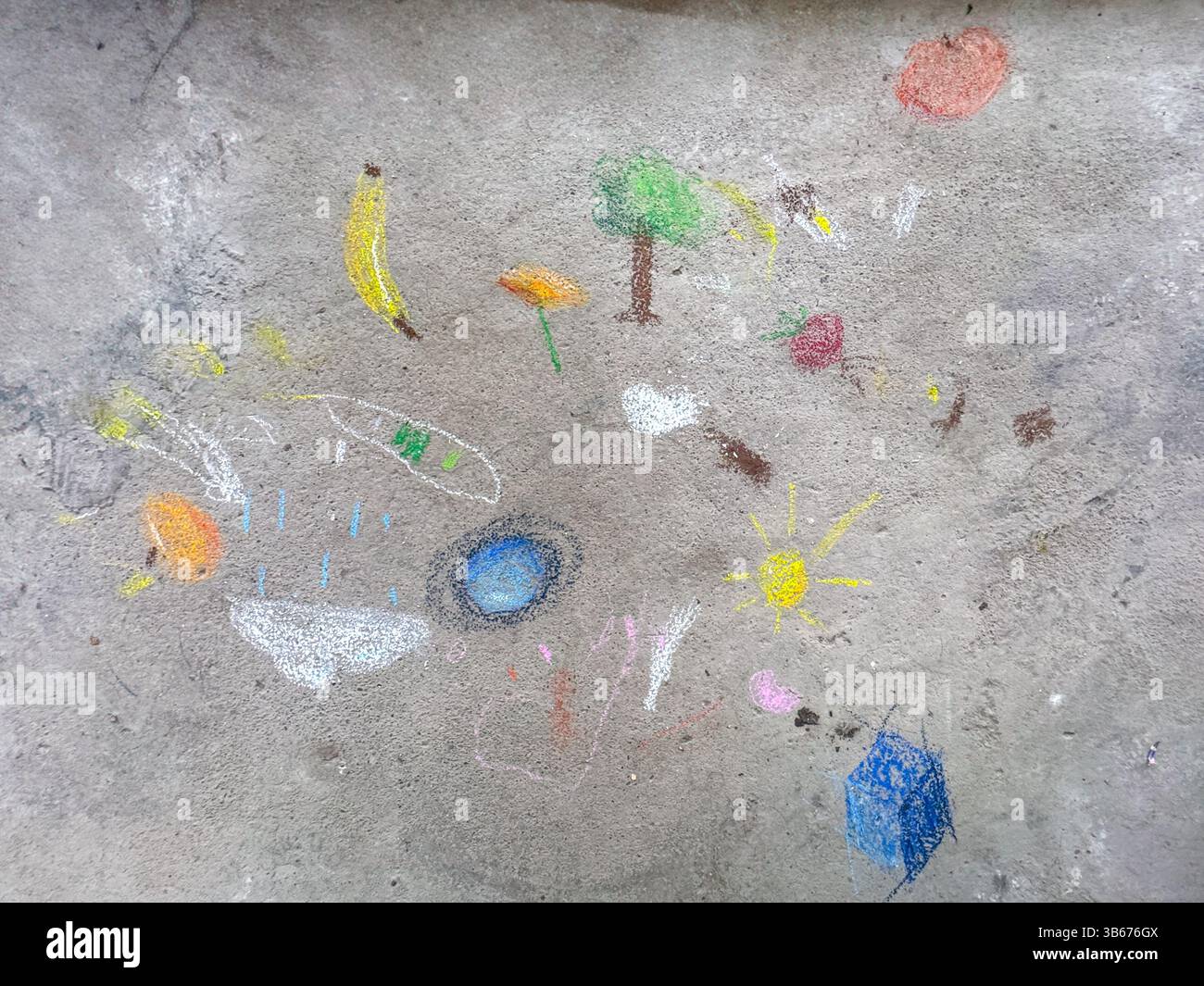 Colorful chalk drawings made by kids on the pavement. Bright, playful ...