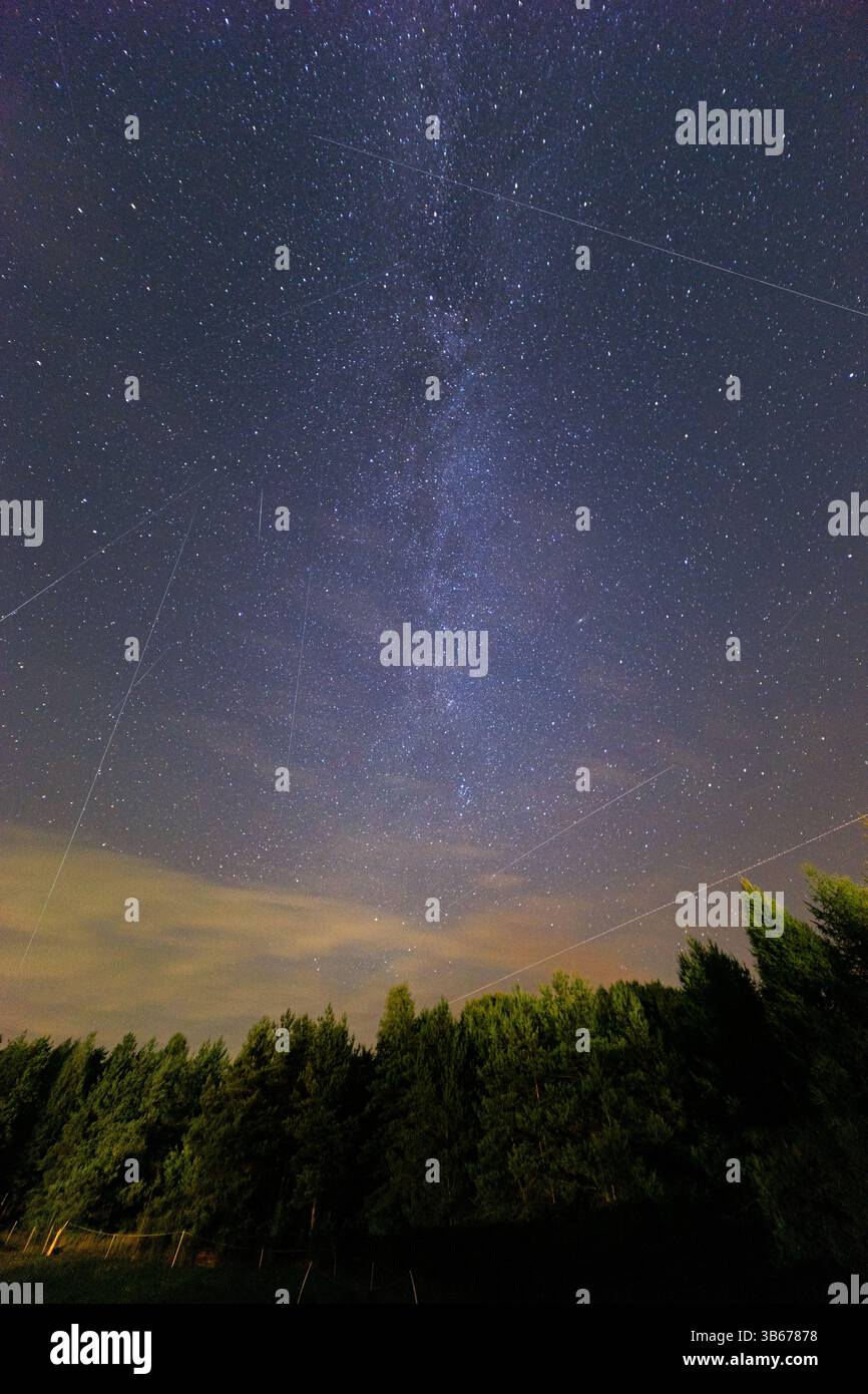 Beautiful dark night sky full of stars and flying Perseids in front of ...