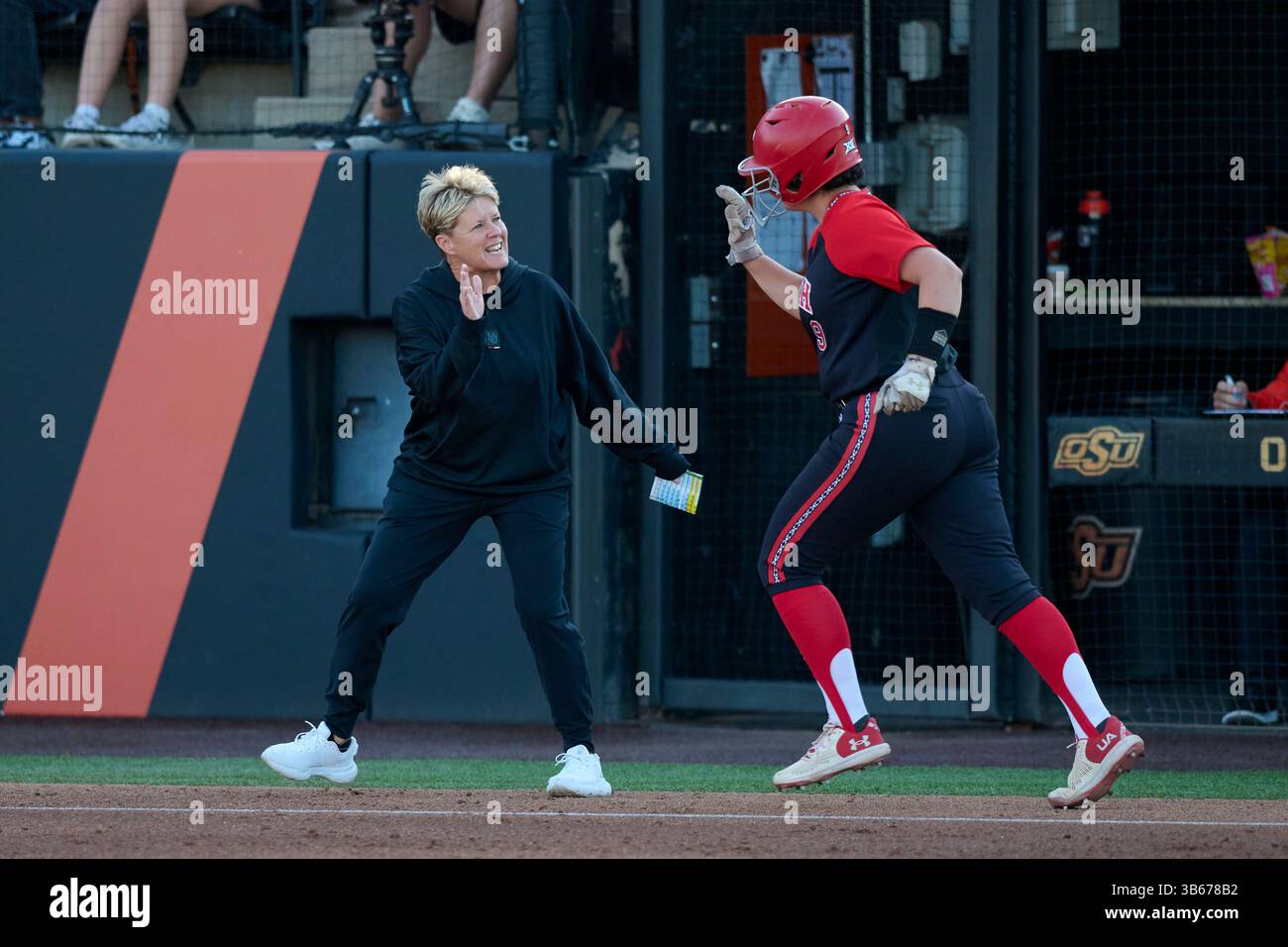 Utah Utes Emily Capobianco (9) high fives head coach Amy Hogue as she ...