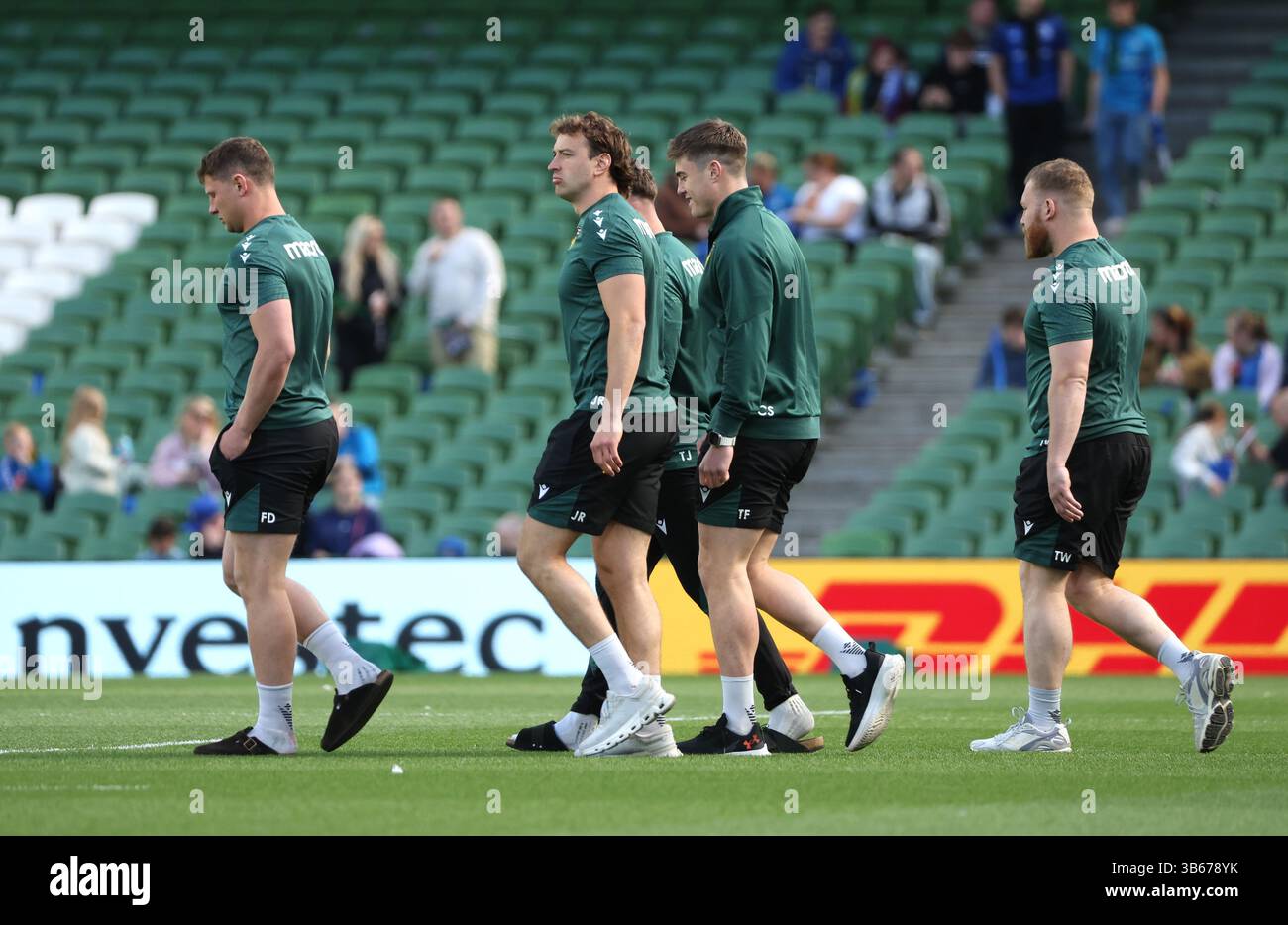 Northampton Saints players inspect the pitch before the Investec ...