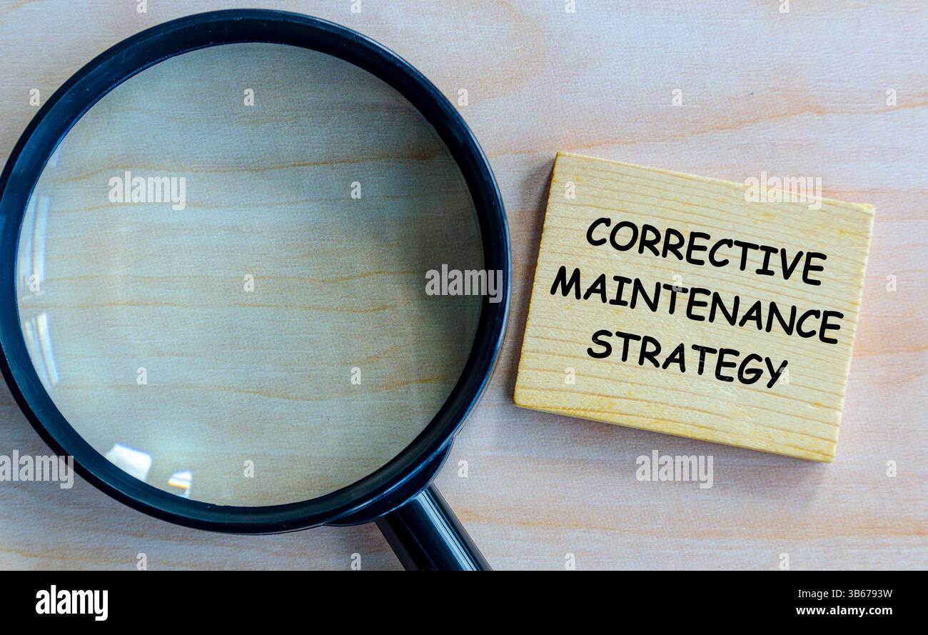 Top view of Corrective Maintenance Strategy text on wooden blocks with ...