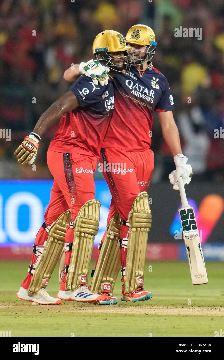 Royal Challengers Bengaluru's Romario Shepherd, left, celebrates with ...