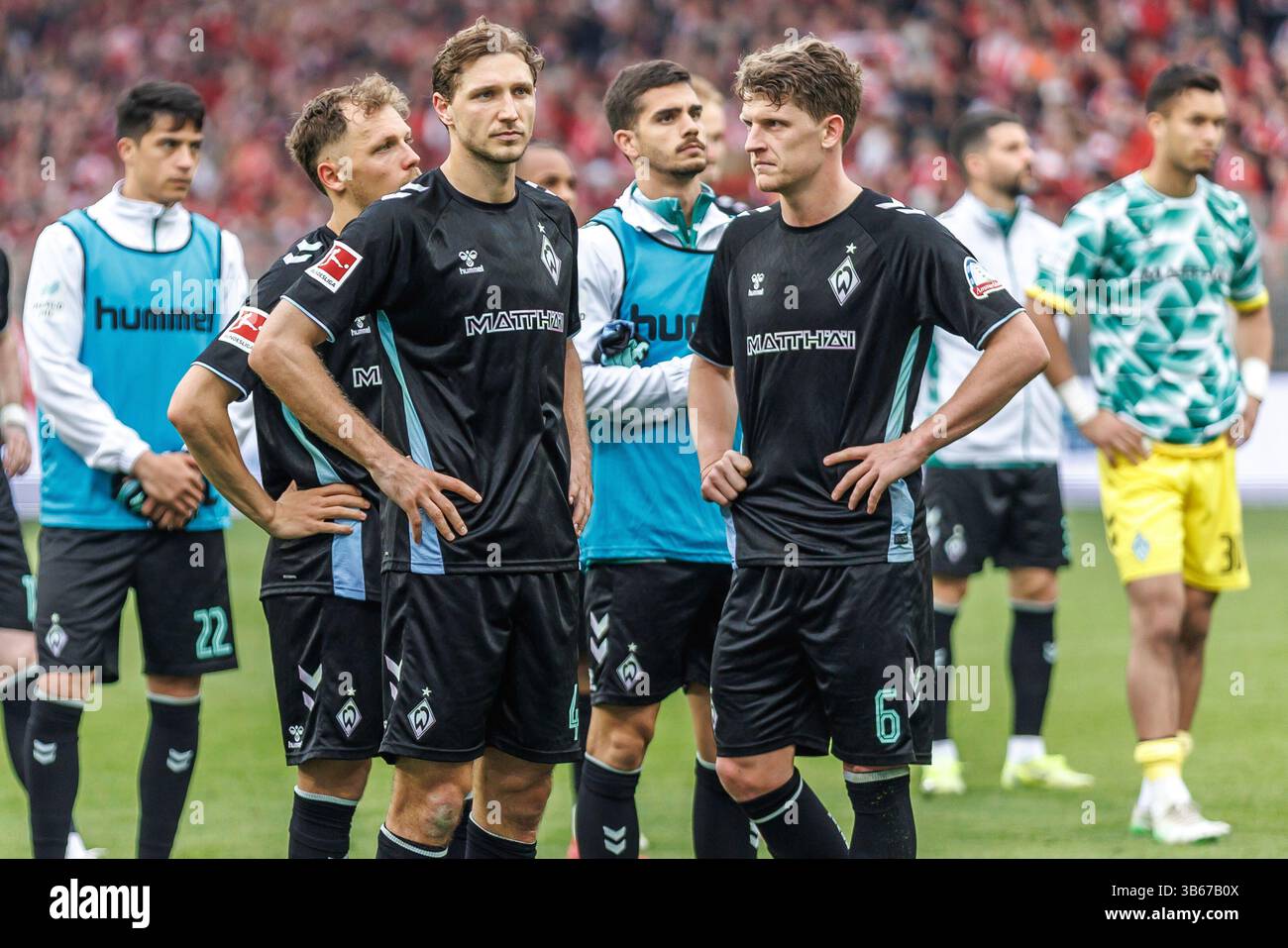 Niklas Stark, left, and Jens Stage of Werder Bremen react after the ...
