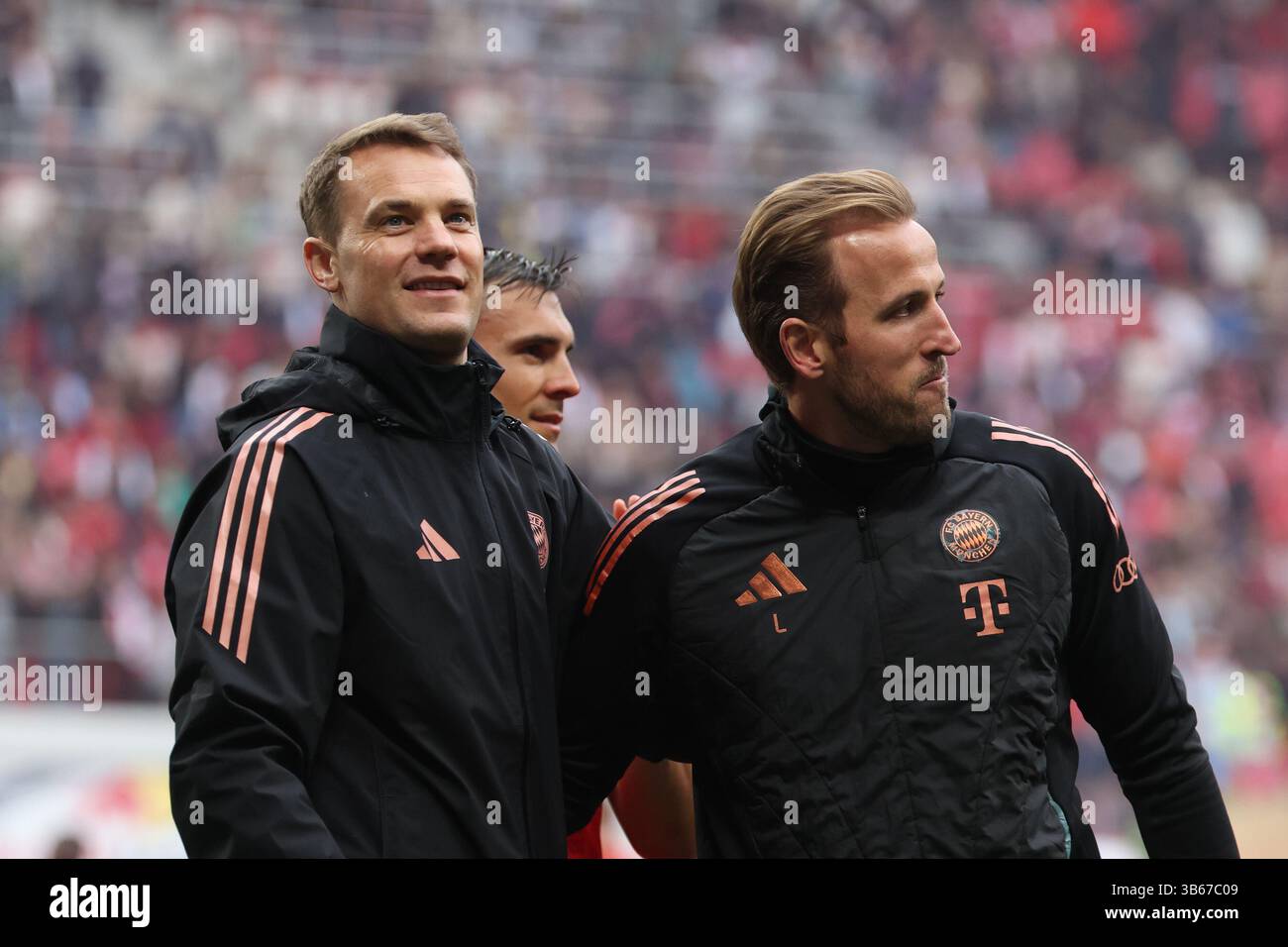 Bayern Munich's Manuel Neuer (left) and Harry Kane after the Bundeliga ...