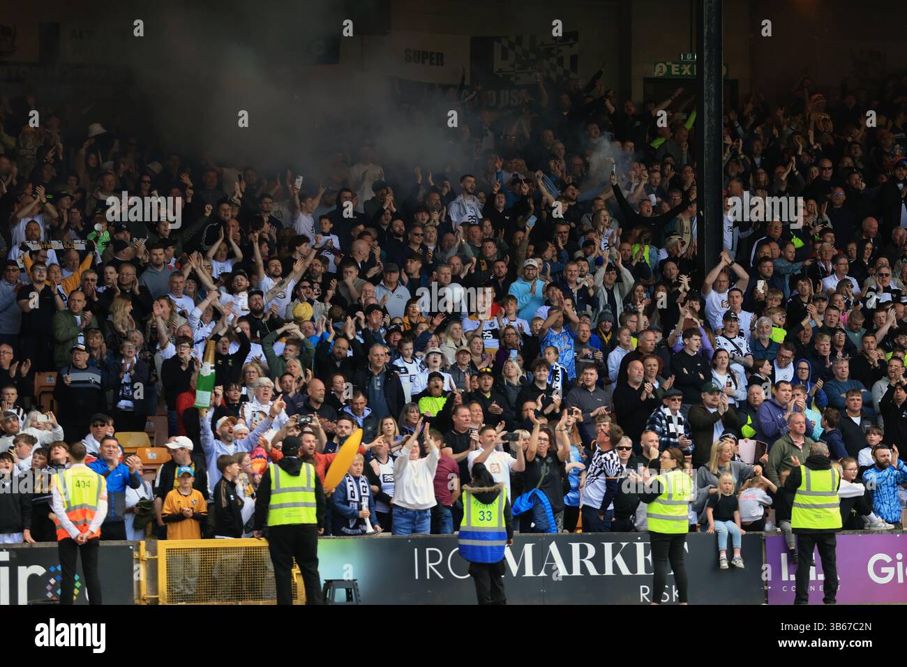 Port Vale fans celebrate promotion after the final whistle of the Sky ...