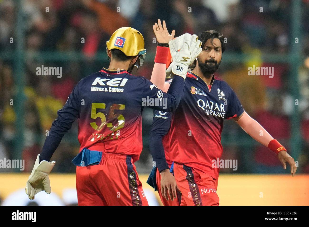 Royal Challengers Bengaluru's Krunal Pandya, right, celebrates with ...