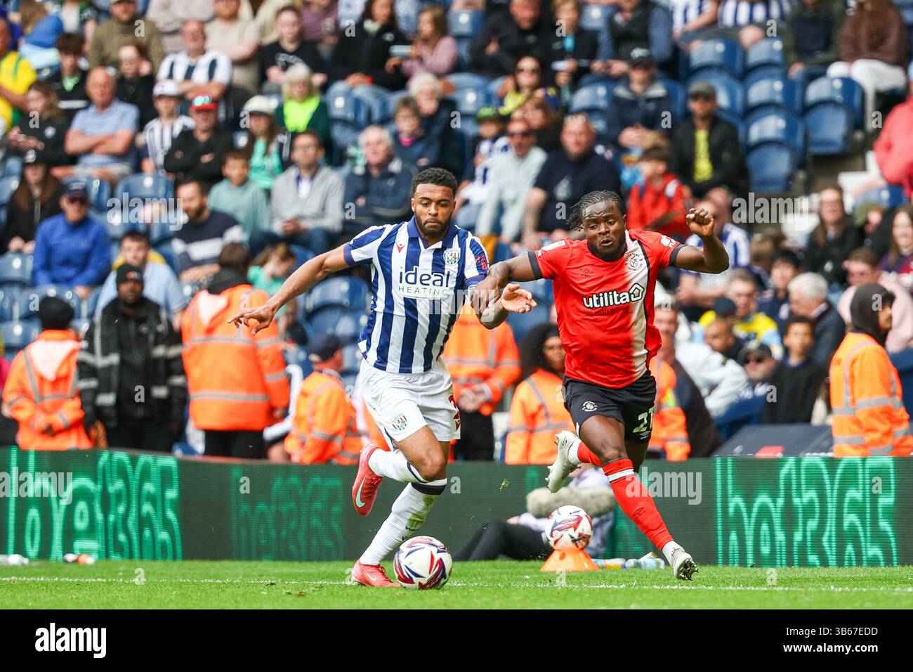 #2, Darnell Furlong of WBA & #21, Millenic Alli of Luton Town in action ...