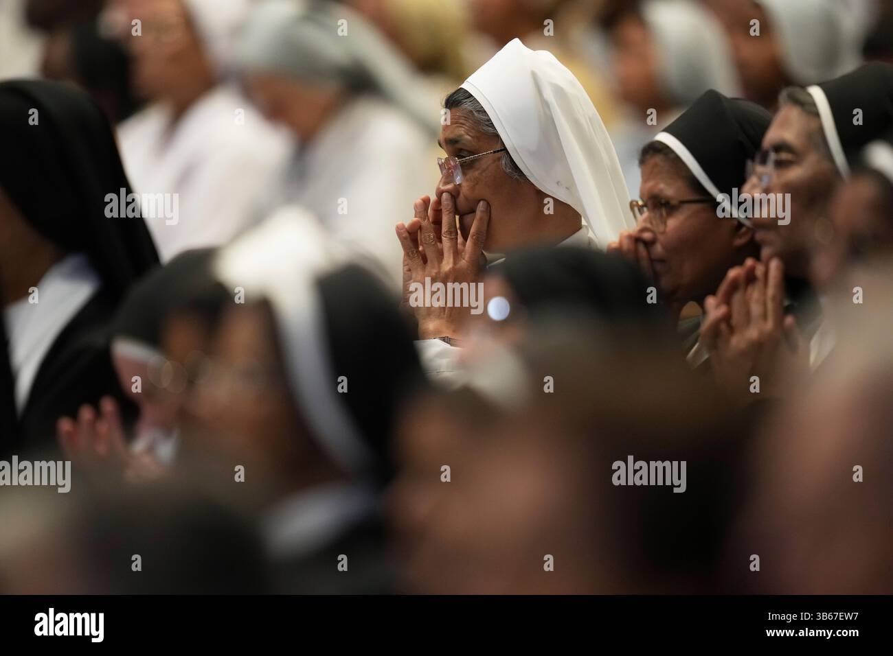 Nuns attend a mass on the eight of nine days of mourning for late Pope ...
