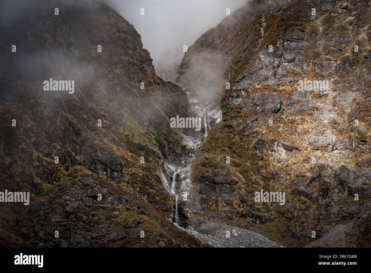 Beautiful Himalayan Glacial Waterfalls in the Mountains with a Bridge ...