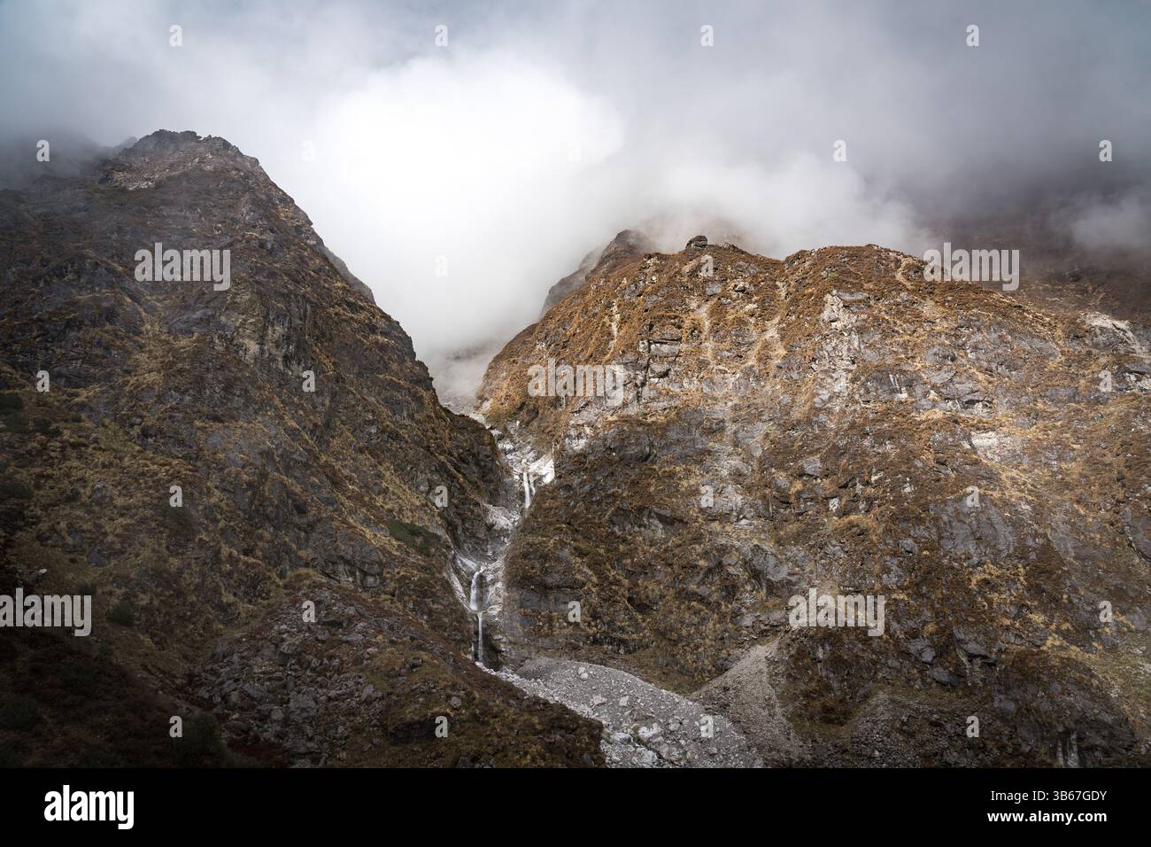 Beautiful Himalayan Glacial Waterfalls in the Mountains with a Bridge ...