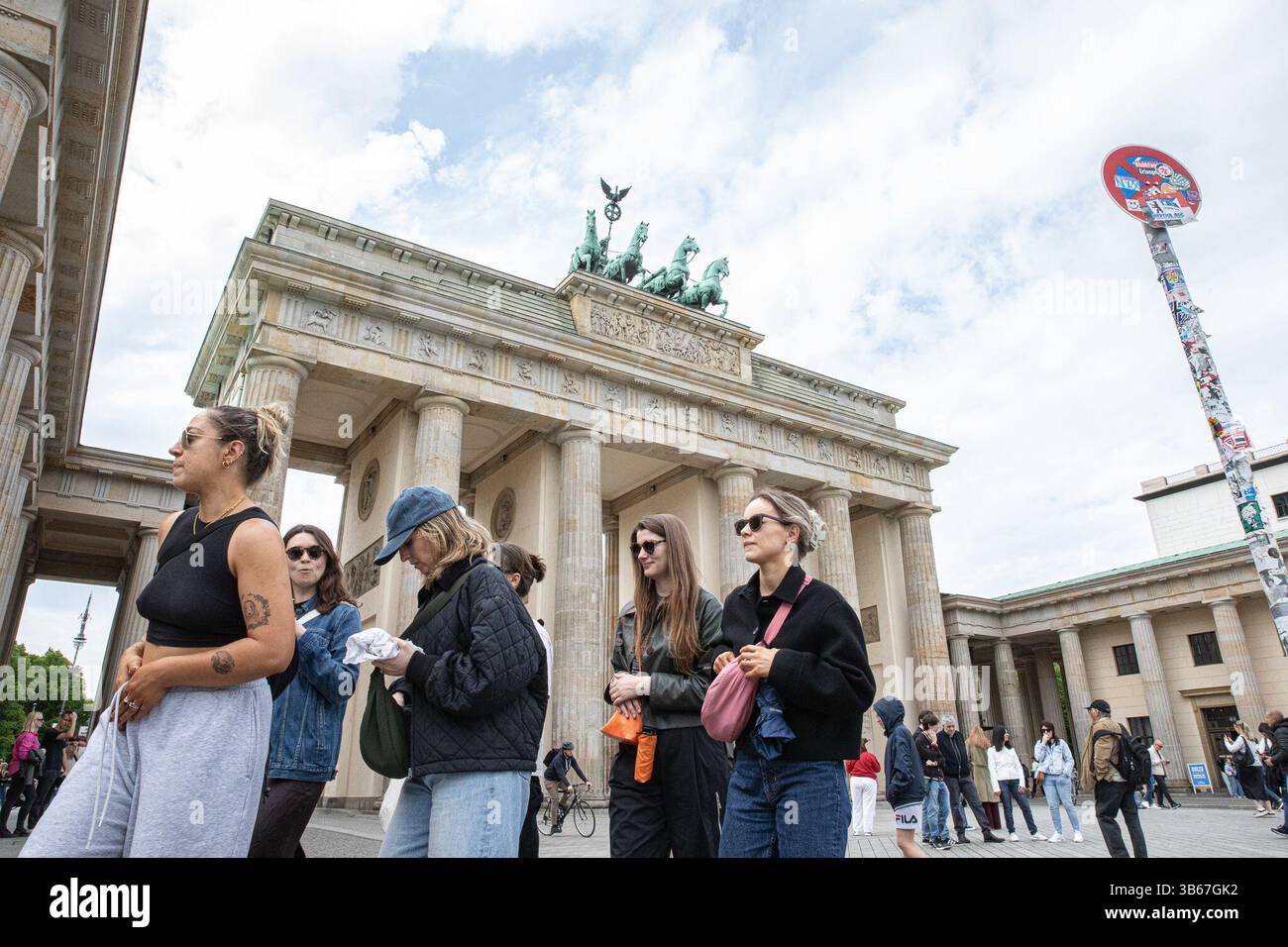 With the Brandenburg Gate as a solemn backdrop, Berlin, on Saturday ...