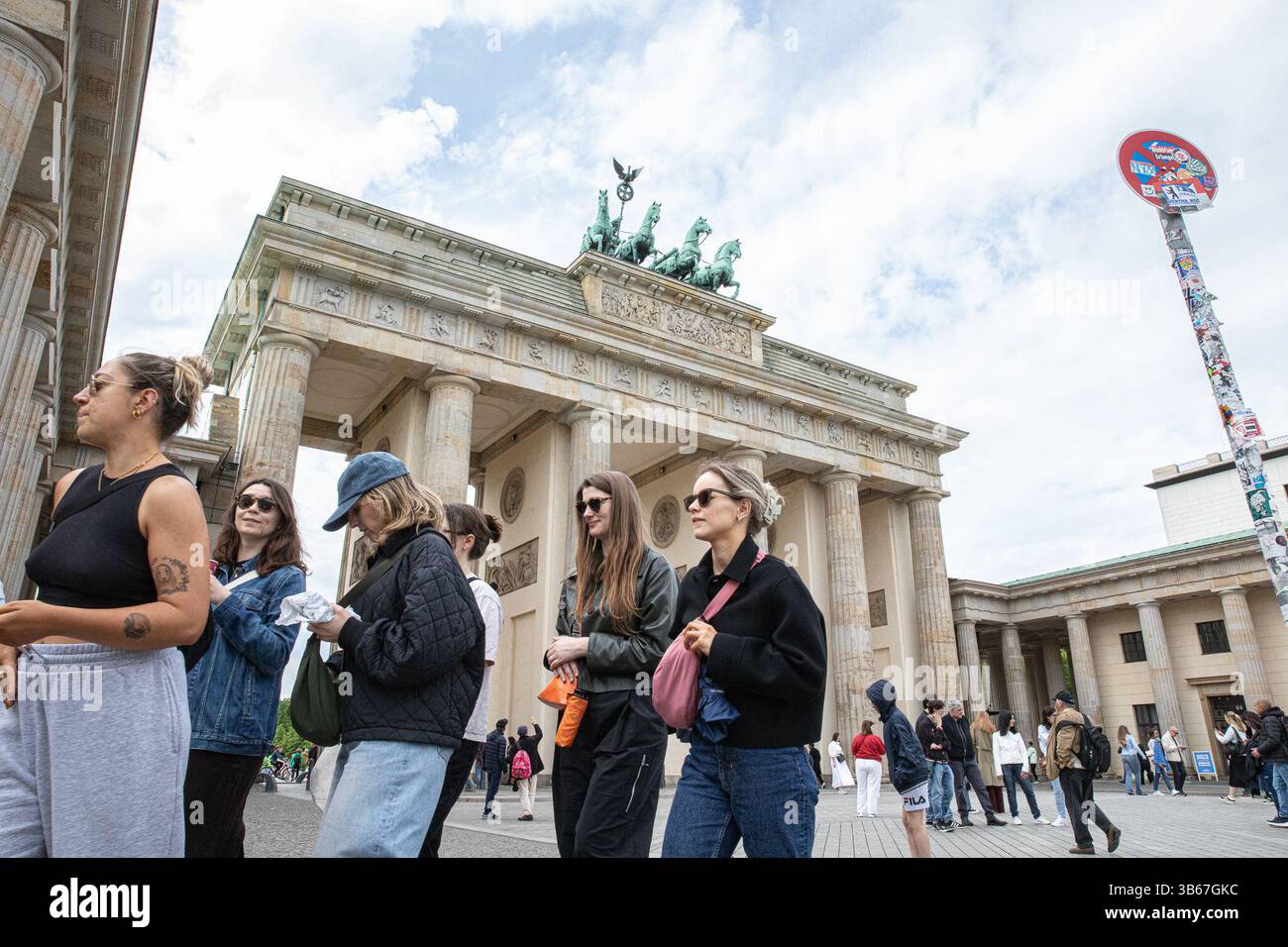 With the Brandenburg Gate as a solemn backdrop, Berlin, on Saturday ...