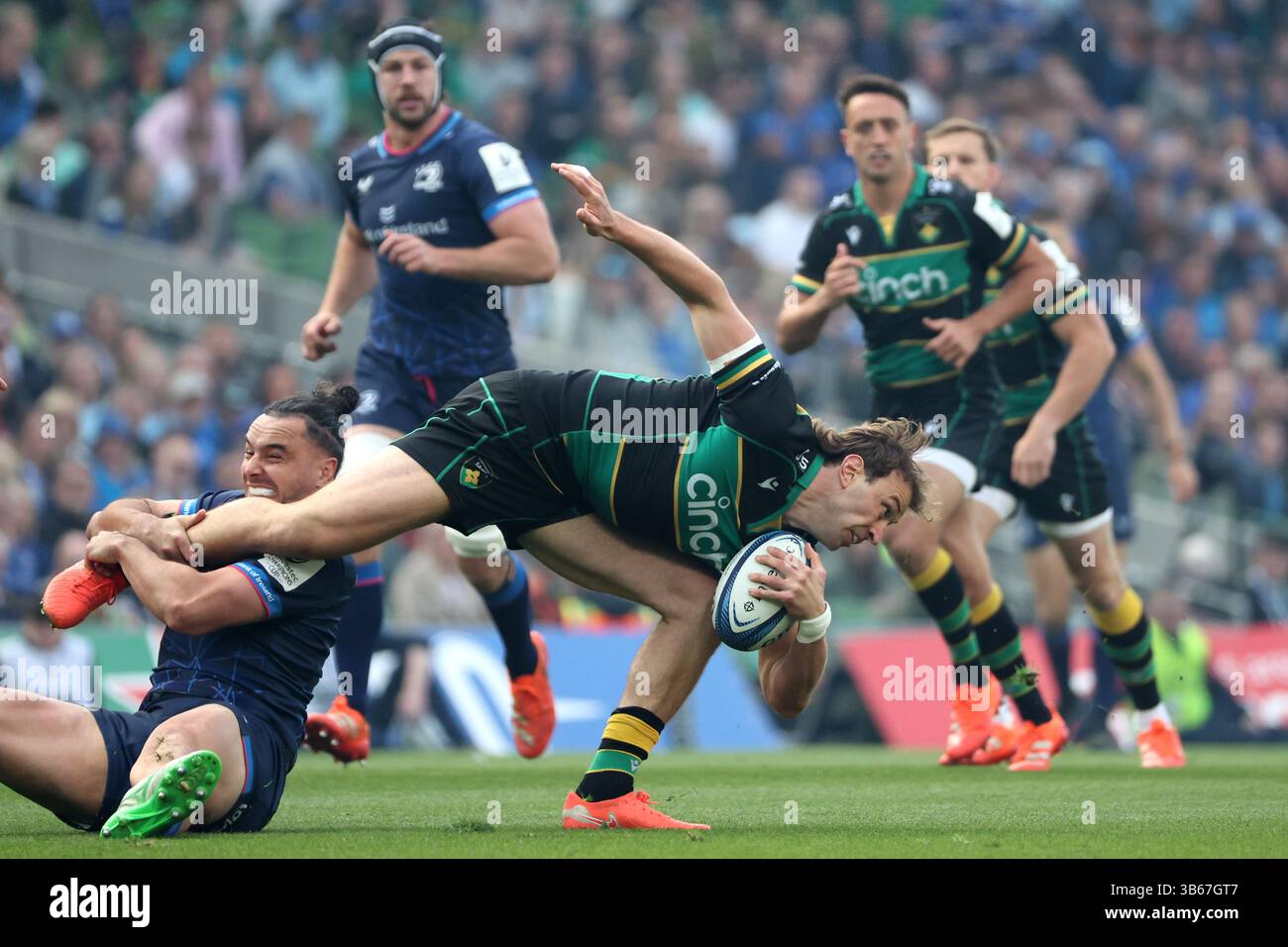 Northampton Saints' James Ramm (right) is tackled by Leinster Rugby's ...