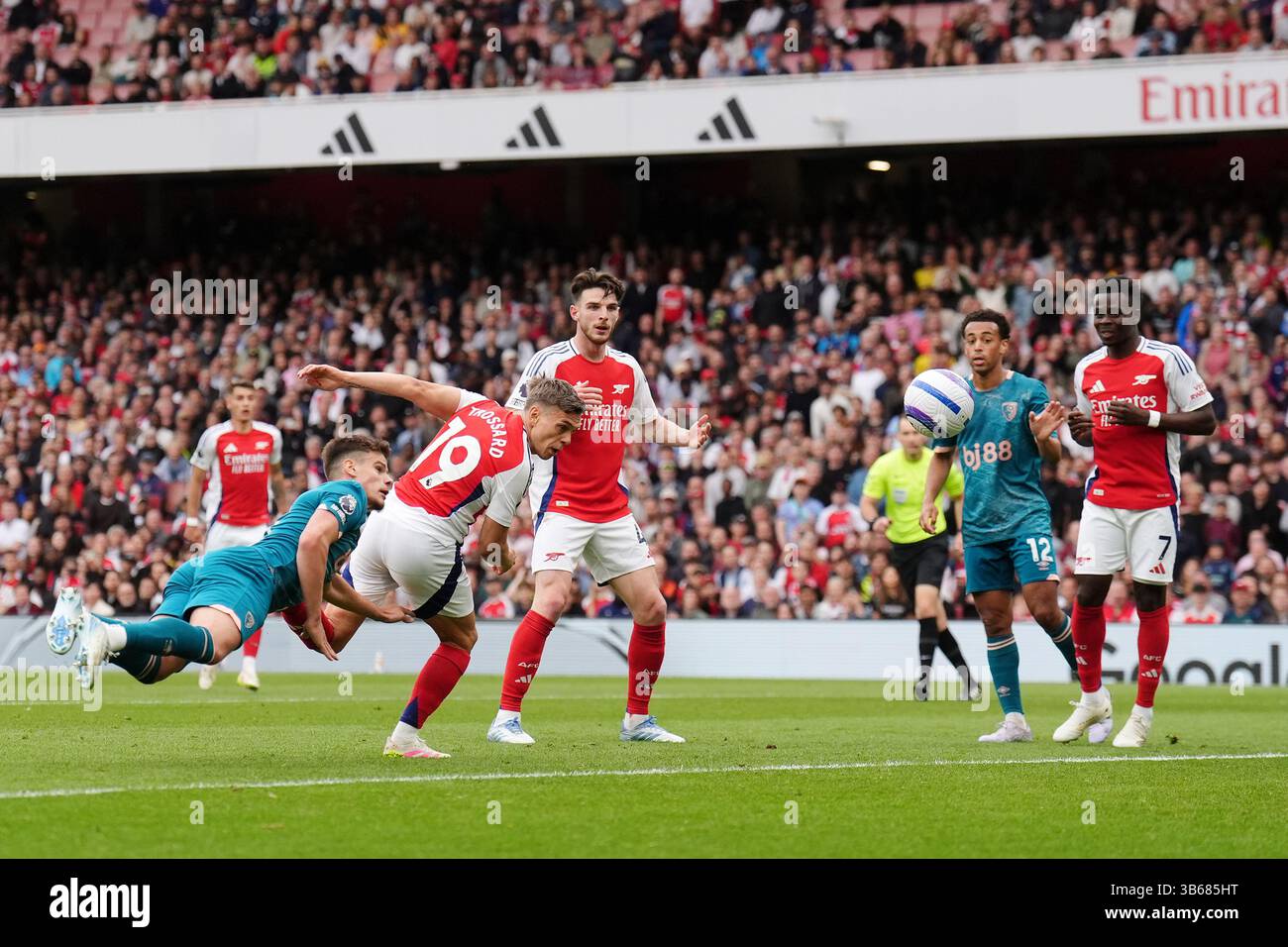 Arsenal's Leandro Trossard (second left) attempts a header on goal ...