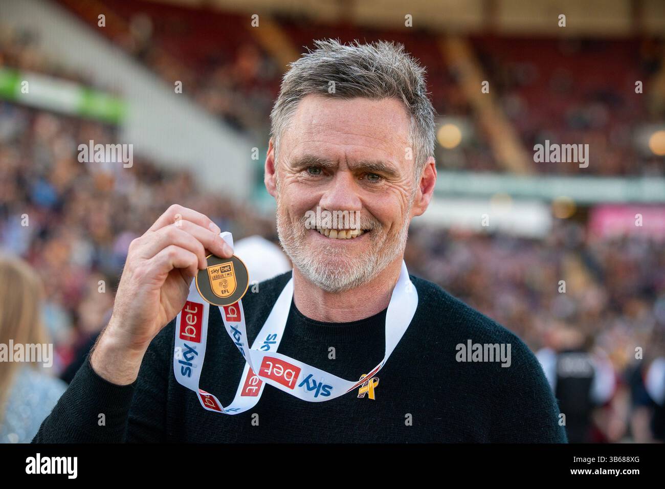 Bradford City manager Graham Alexander celebrates promotion after ...