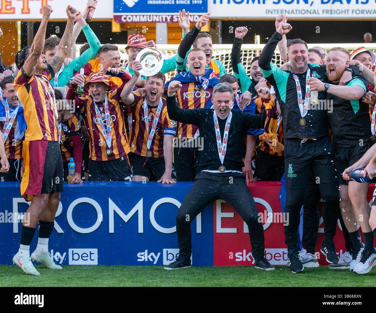 Bradford City manager Graham Alexander celebrates promotion after ...