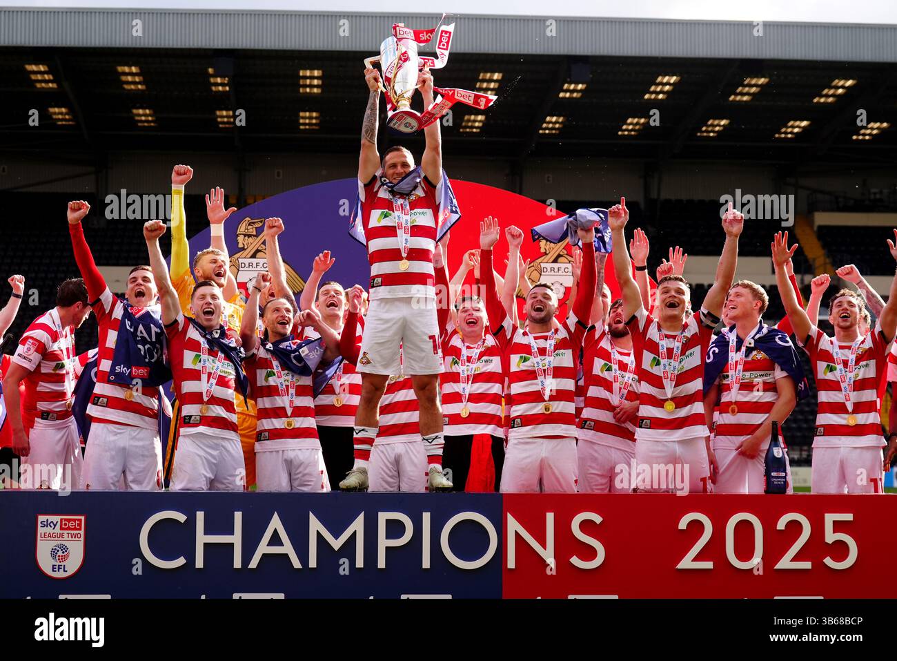 Doncaster Rovers Billy Sharp lifts the trophy after the Sky Bet League ...