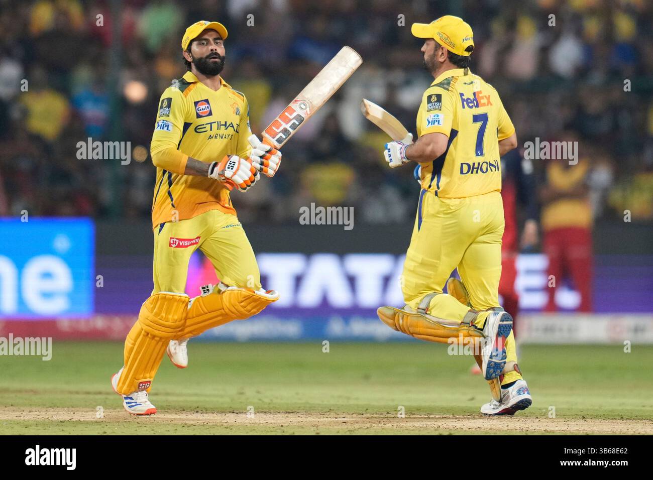 Chennai Super Kings' captain Mahendra Singh Dhoni, right, and batting partner Ravindra Jadeja ...