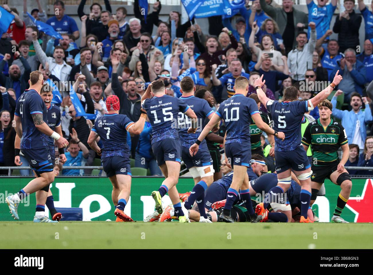 Leinster Rugby's Caelan Doris (hidden) scores his side's third try of ...