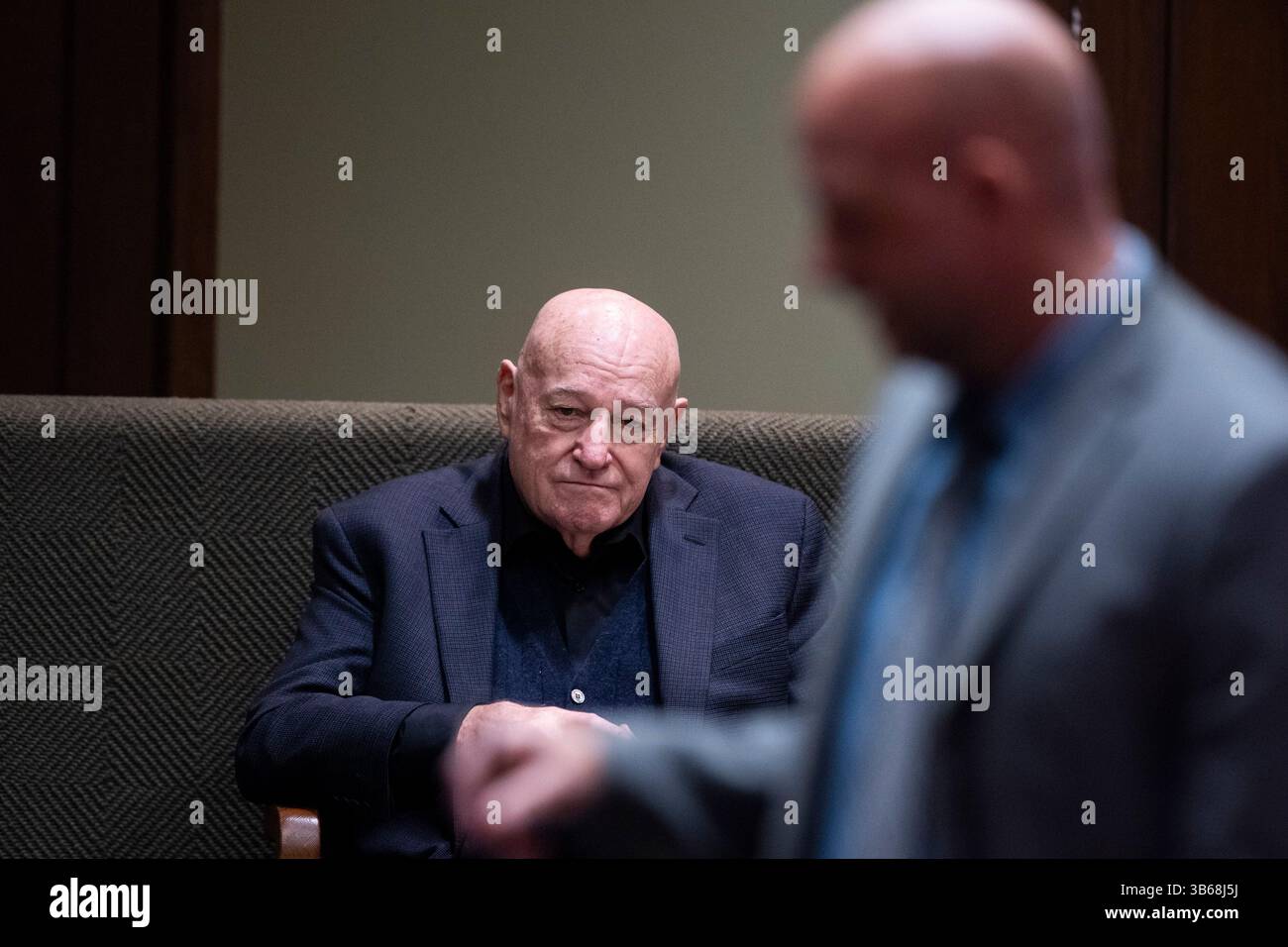Don Cameron, a use of force expert, listens to a question from Shelby ...