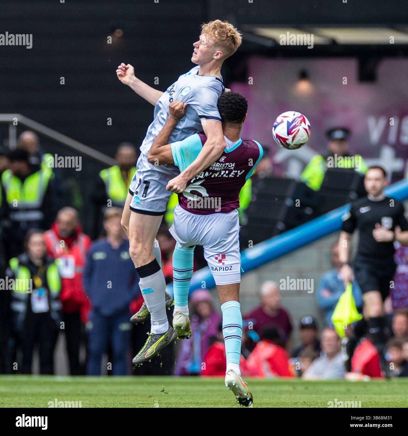 Josh Coburn #21 of Millwall F.C. in a tussle with CJ Egan-Riley #6 of ...