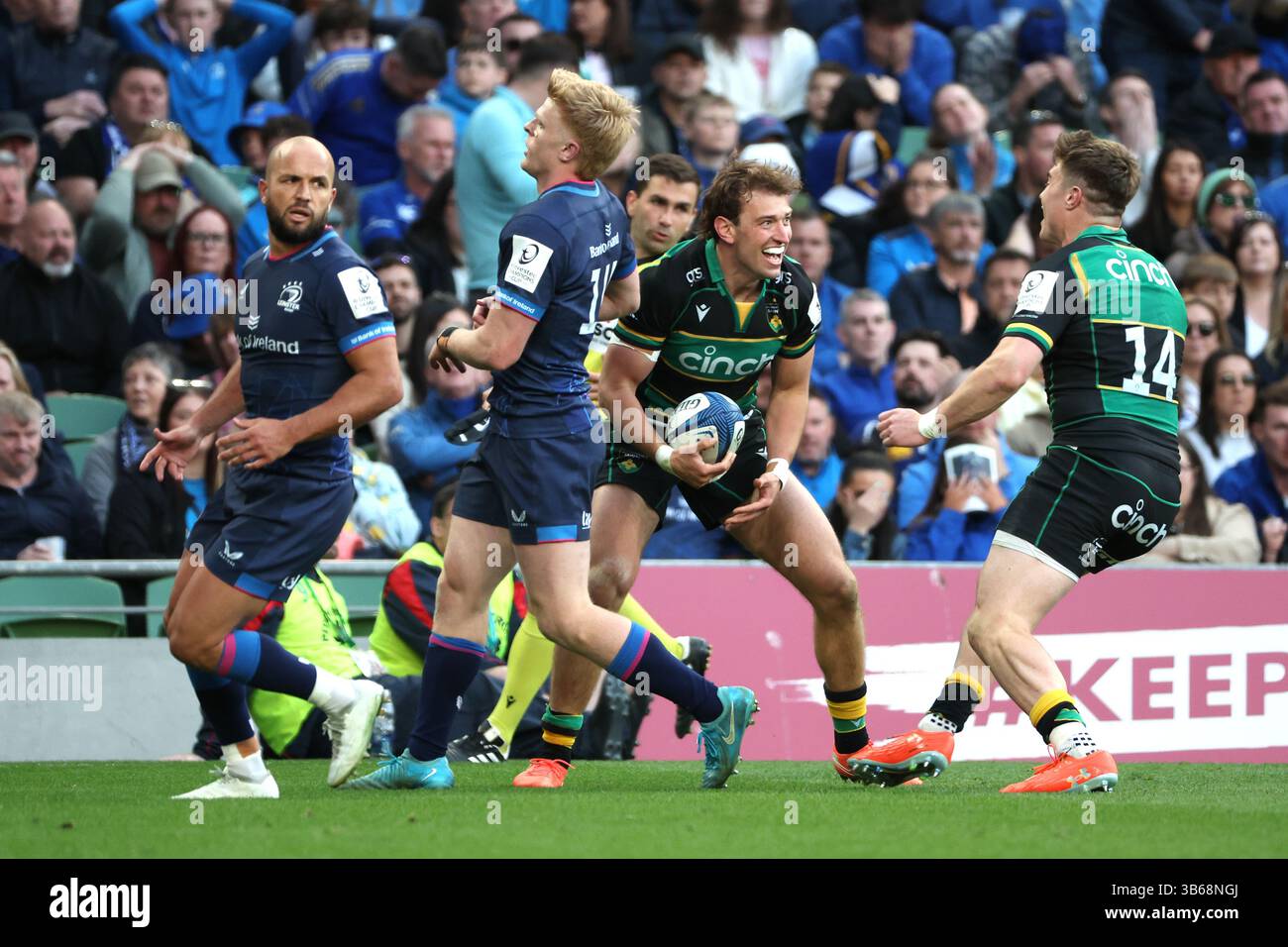 Northampton Saints' James Ramm (centre) celebrates scoring his side's ...