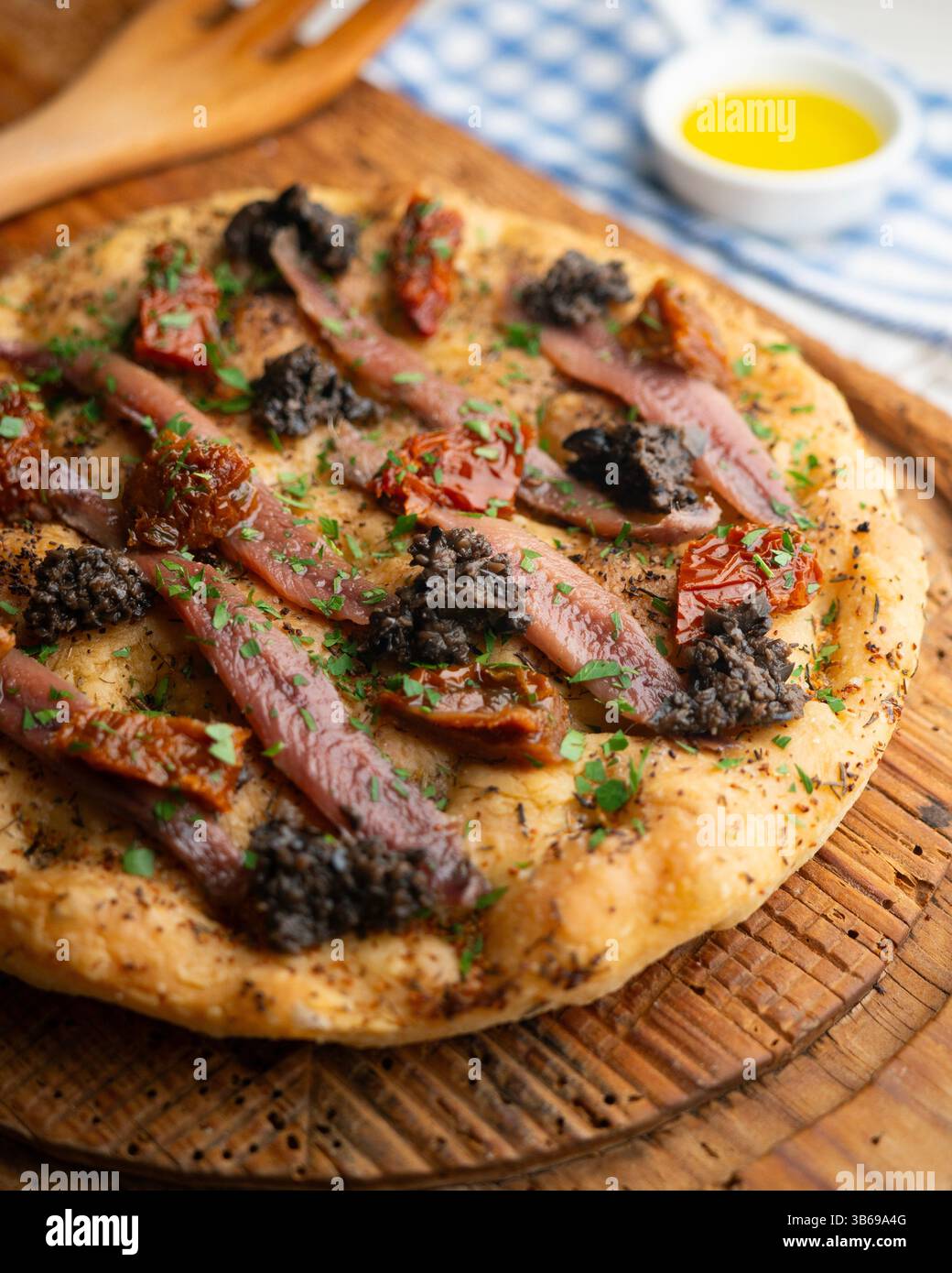 Authentic Italian focaccia with salted anchovies, sun-dried tomatoes ...