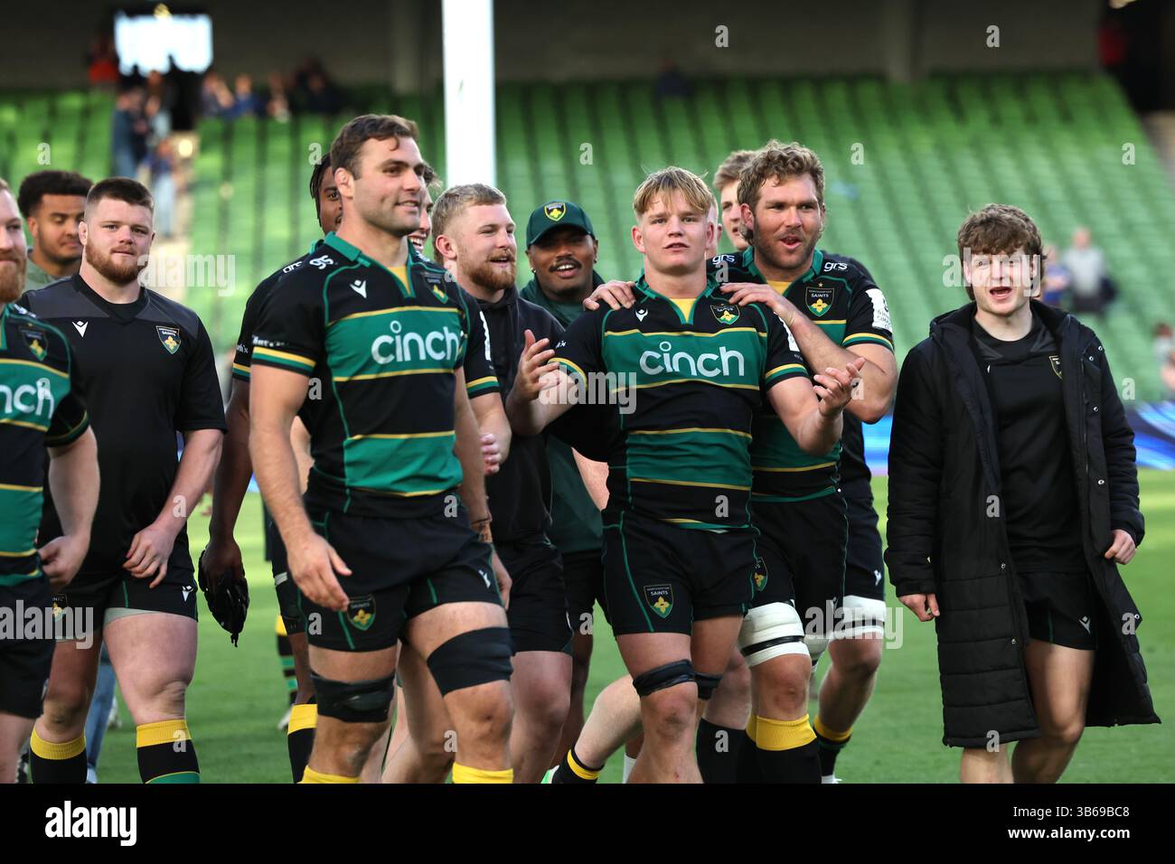 Northampton Saints players celebrate following victory in the Investec ...