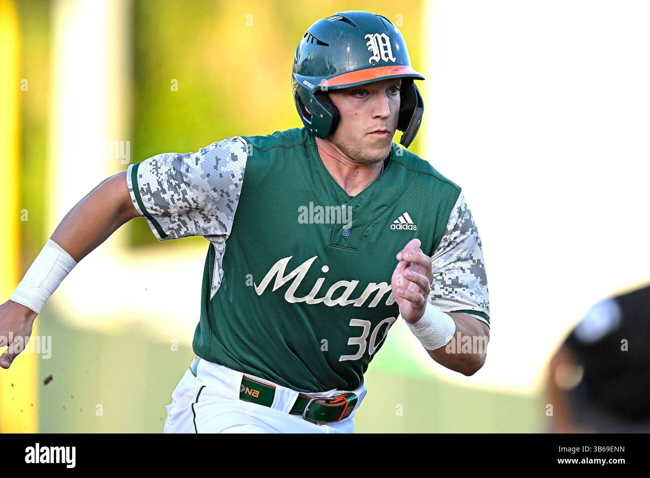 CORAL GABLES, FL - MAY 02: Miami catcher Tanner Smith (30) runs to ...
