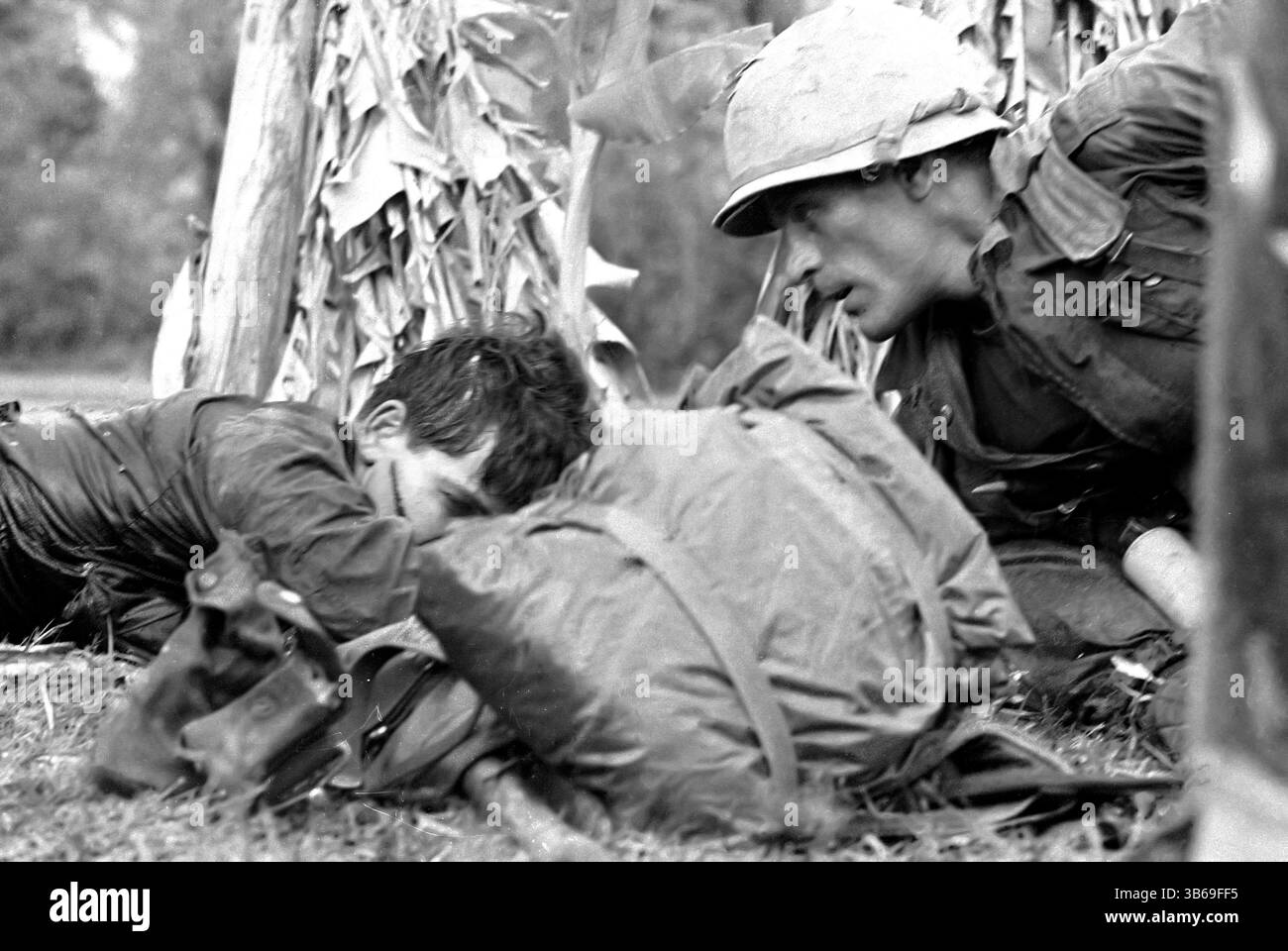 U.S. Army soldier crawls to a mortally wounded soldier while under ...