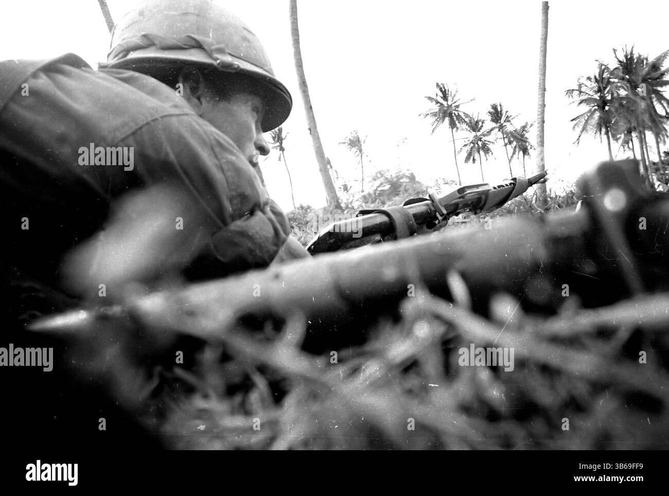 U.S. Army soldier directs others in his squad while under fire during ...